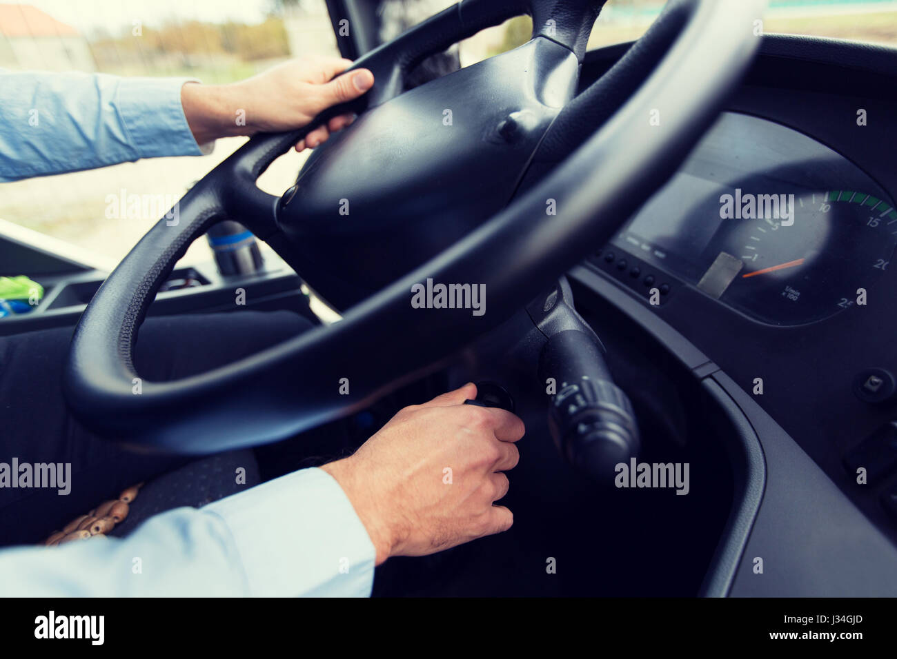 close up of driver starting bus Stock Photo - Alamy