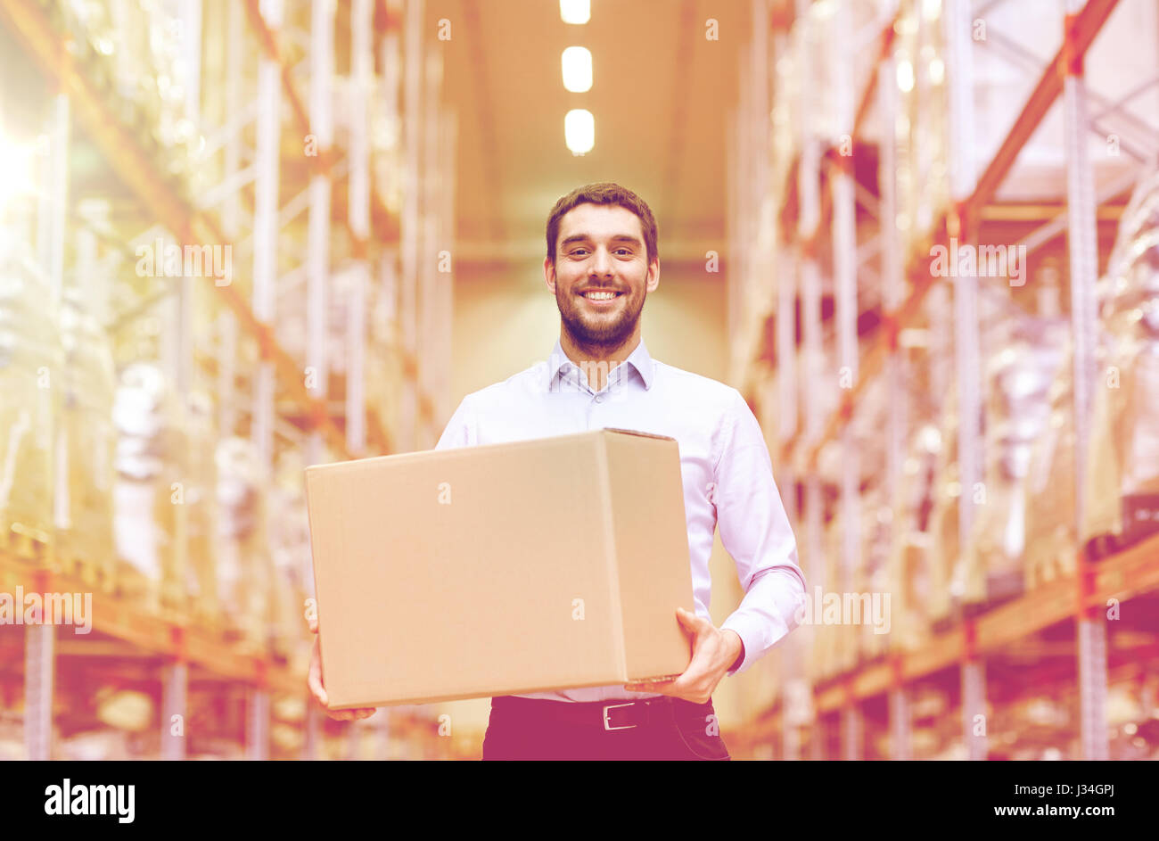 Smiling businessman cardboard box hi-res stock photography and images ...