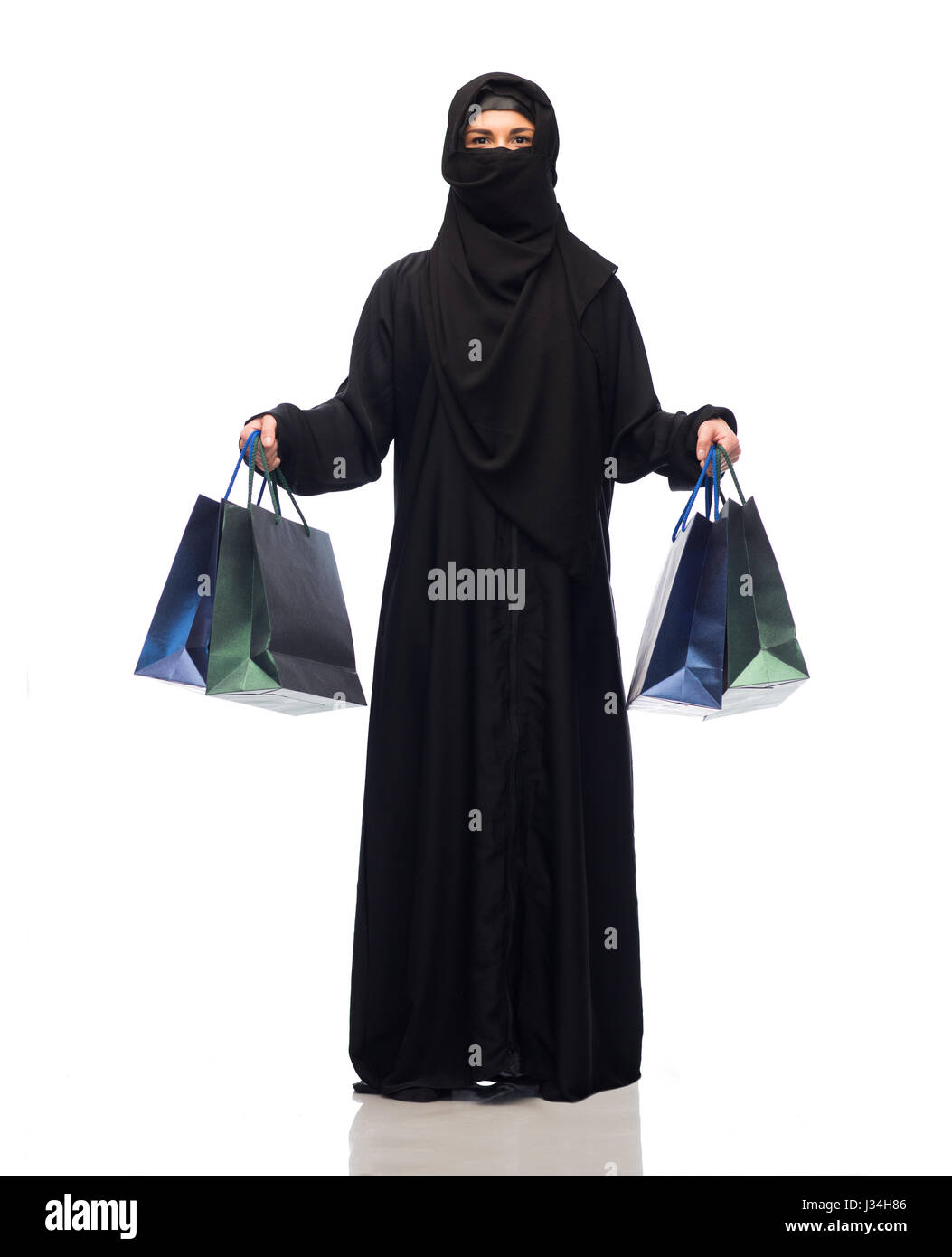 muslim woman in hijab with shopping bags Stock Photo - Alamy