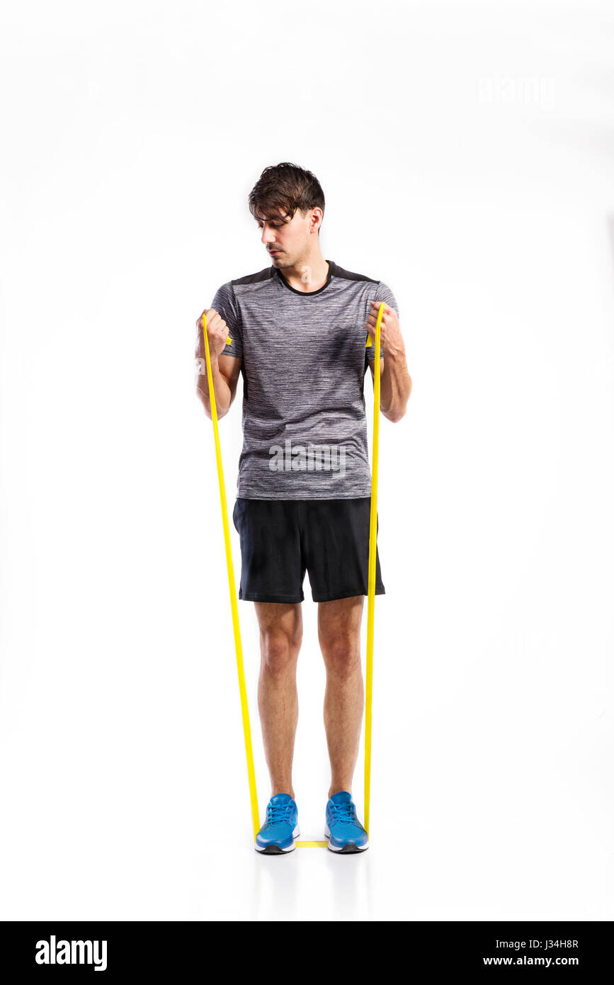 Resistance band exercise biceps Cut Out Stock Images & Pictures - Alamy