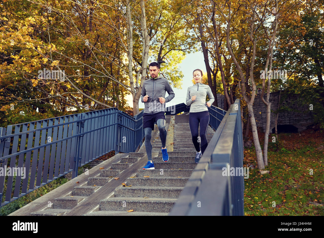 Couple in sportswear running up stairs hi-res stock photography and ...