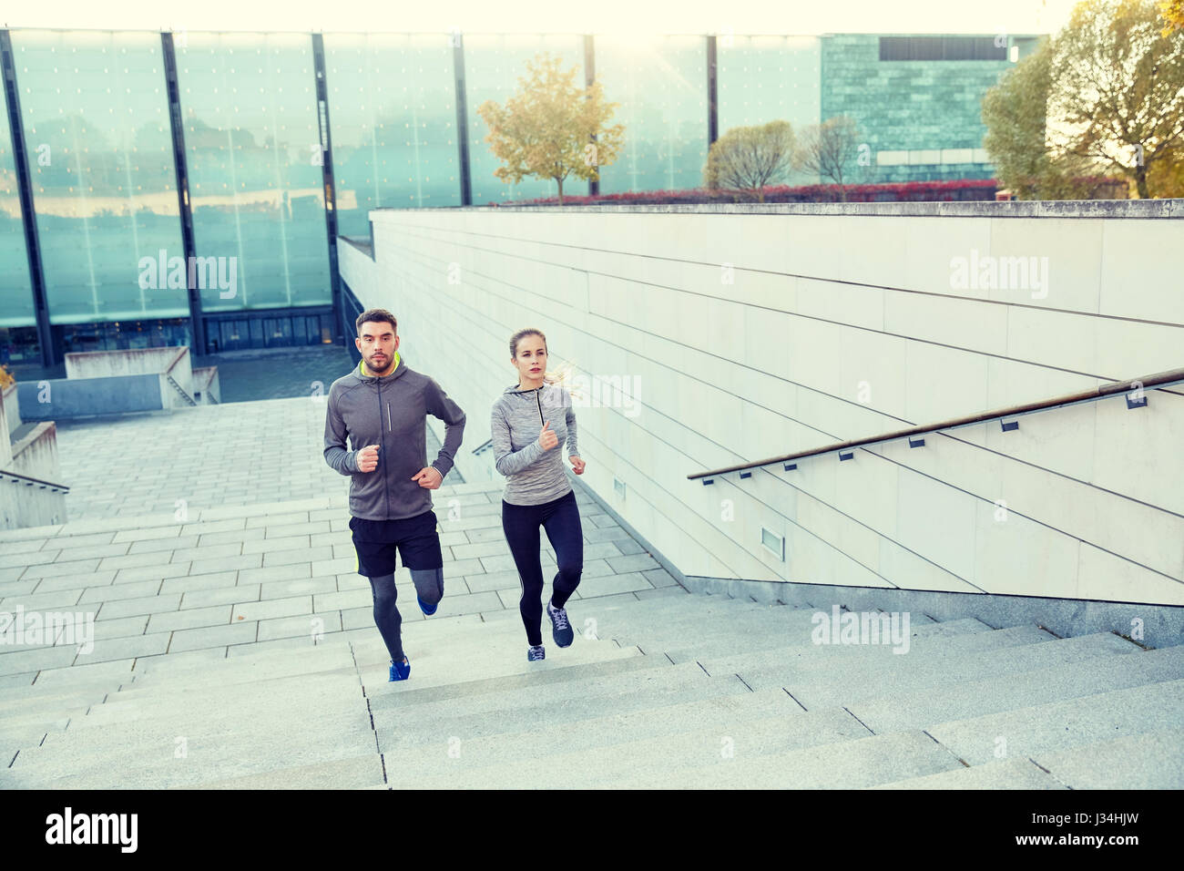 Happy young man running upstairs hi-res stock photography and images ...