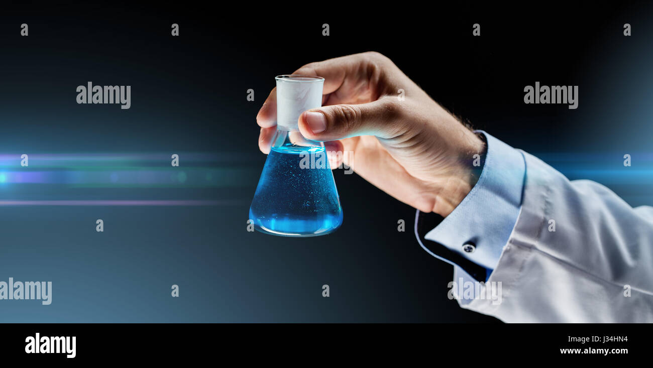 close up of scientist holding flask with chemical Stock Photo - Alamy
