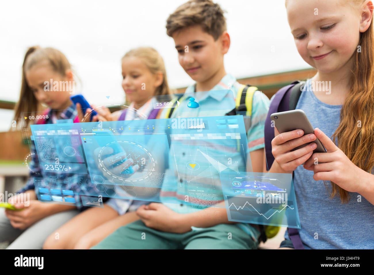 elementary school students with smartphones Stock Photo - Alamy