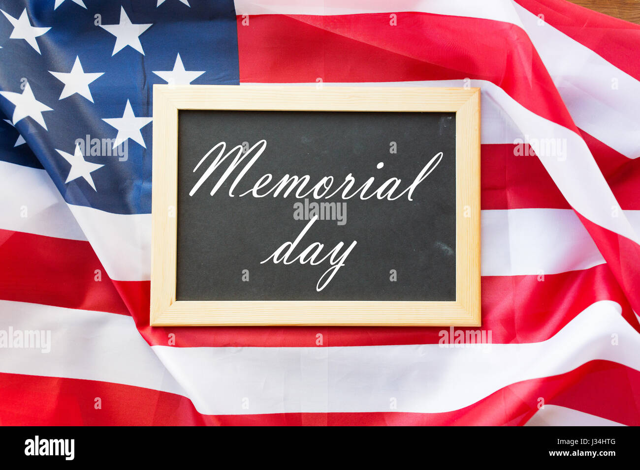memorial day words on chalkboard and american flag Stock Photo - Alamy