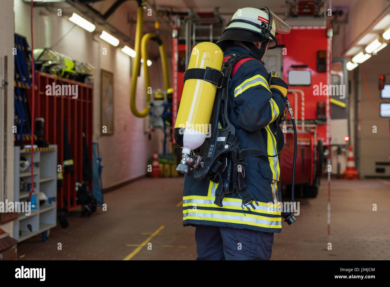German Firefighter in action with oxygen tank Stock Photo - Alamy