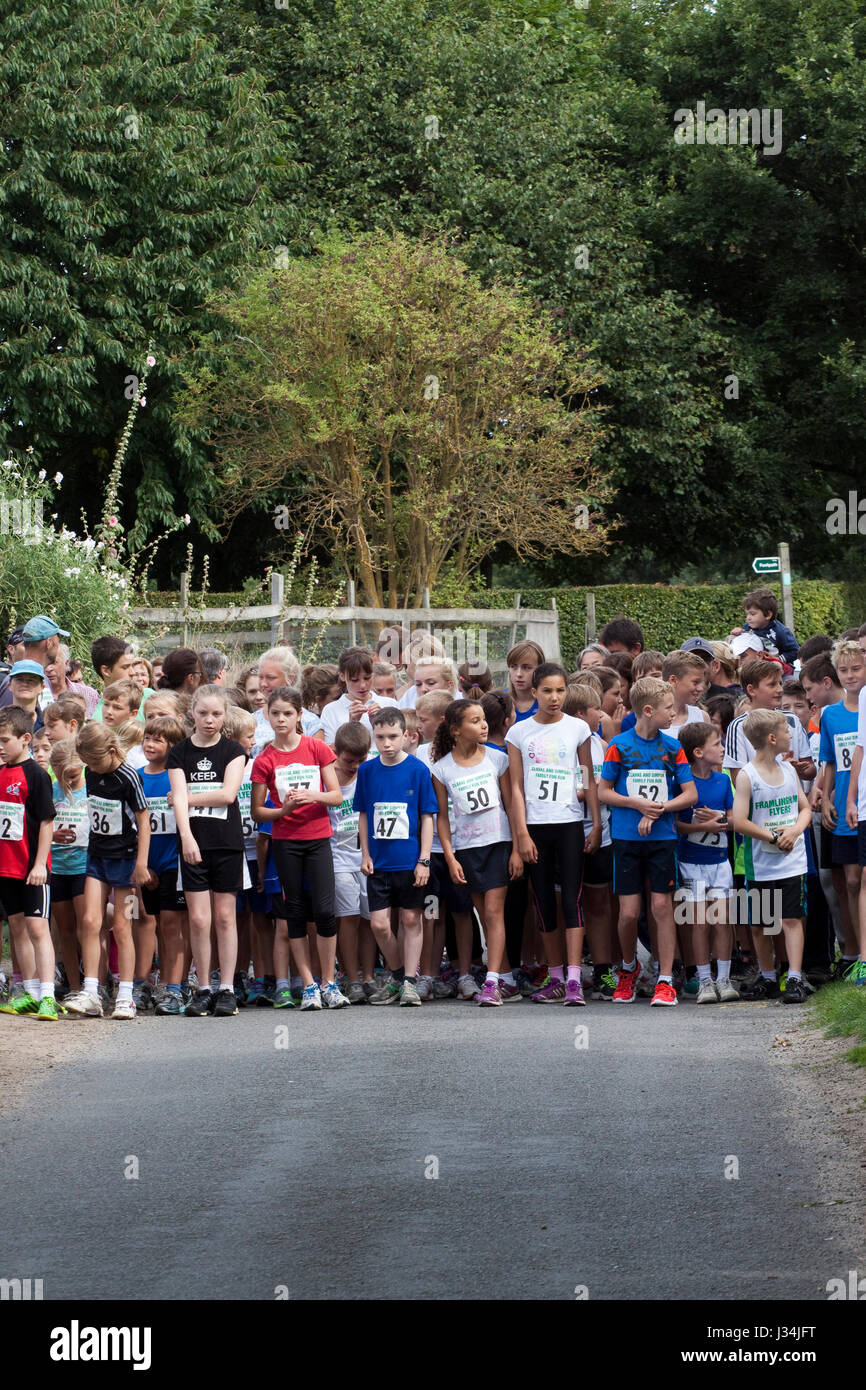 Runners wait for the start of a road race Stock Photo - Alamy