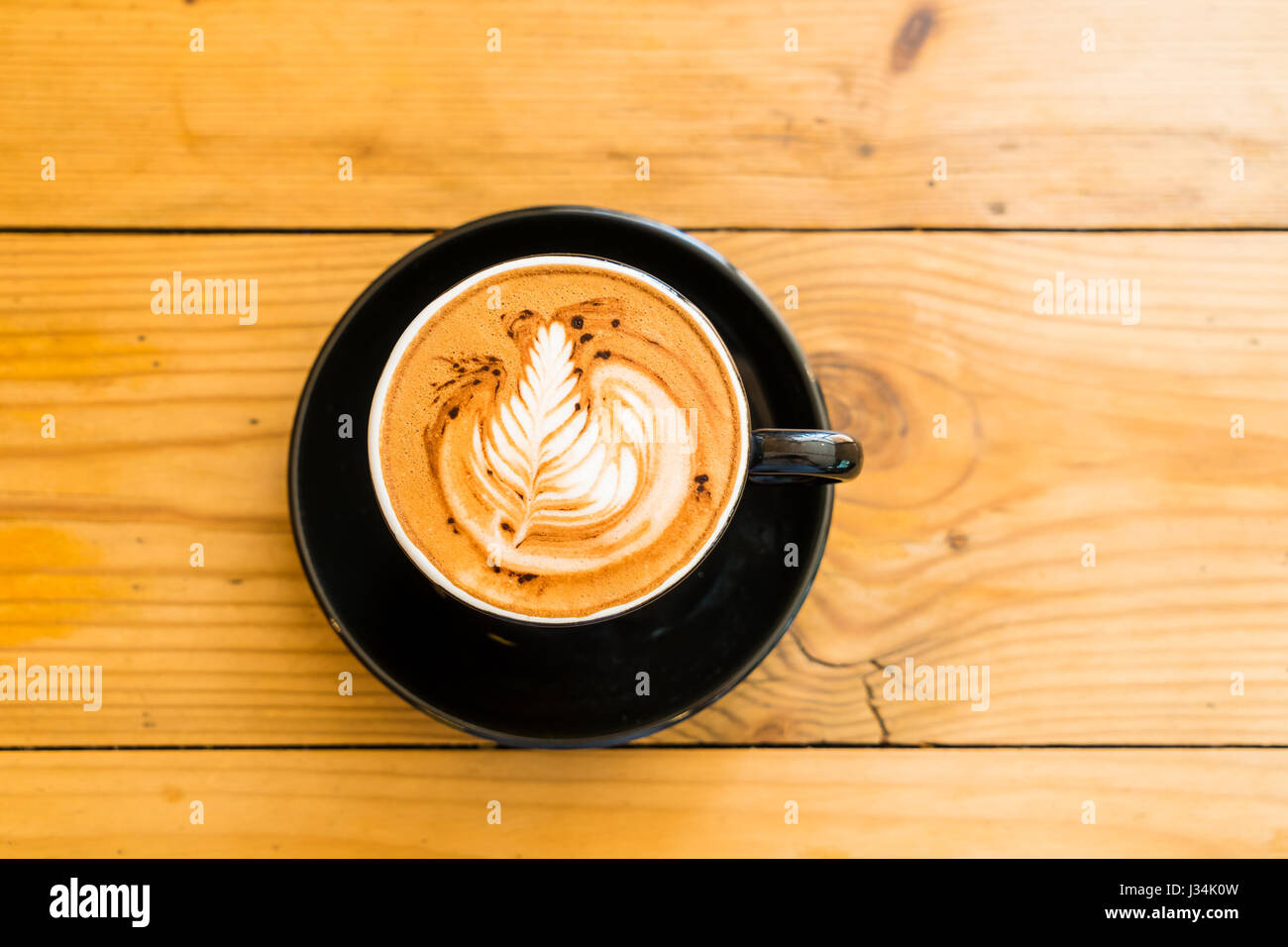 Hot Coffee Mocha on the brown wooden table with chocolate. Top view ...