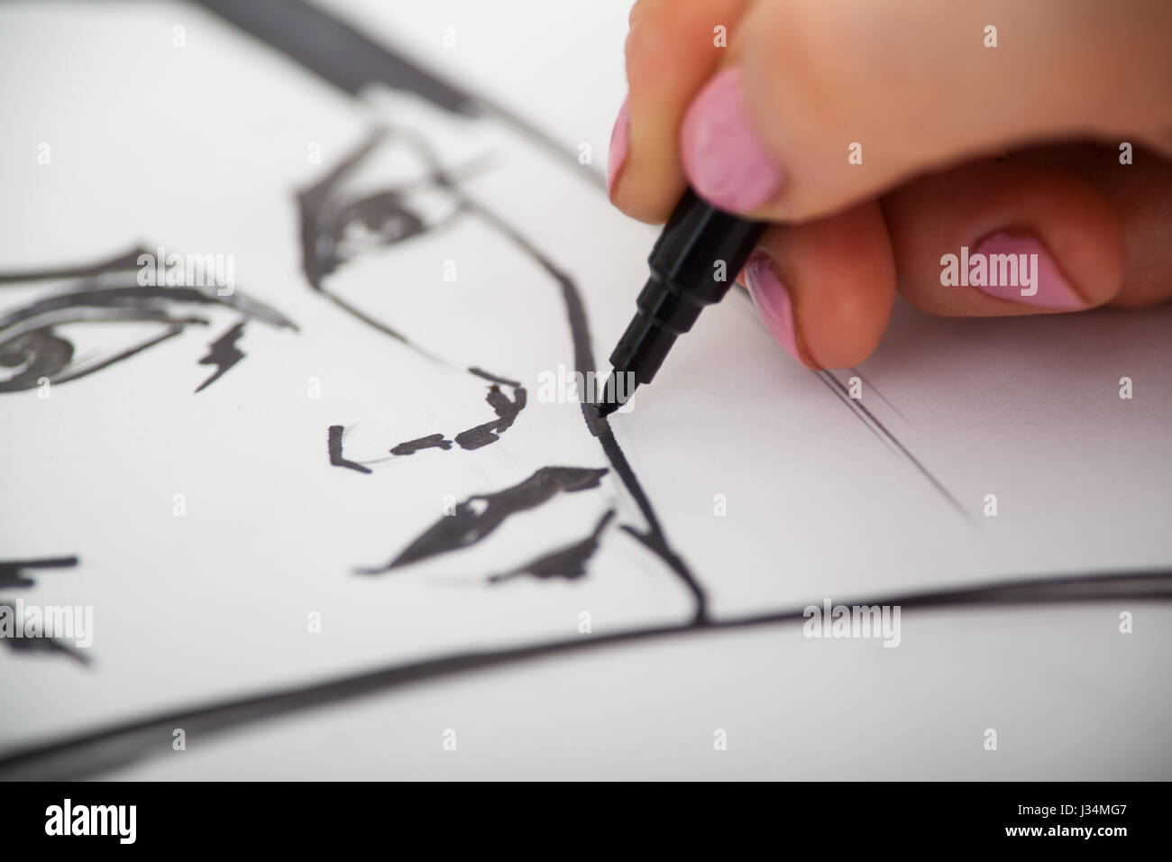 Closeup of drawing woman's portrait at the desk Stock Photo - Alamy
