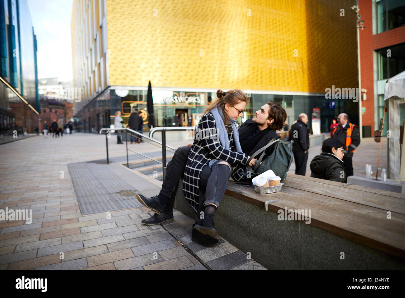 Manchester city centre Home at first Street couple sat relaxing Stock ...