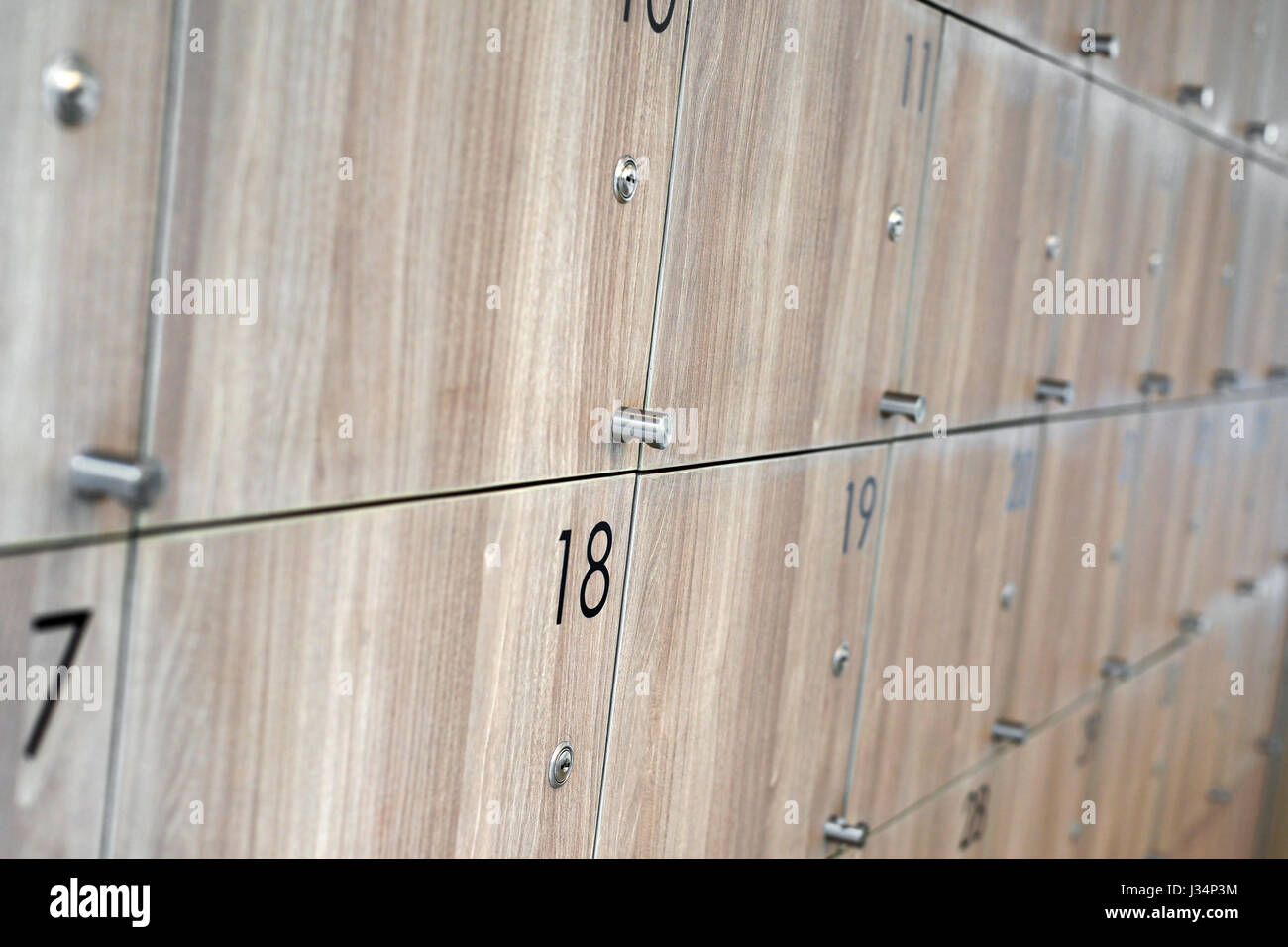 wooden locker with number in front of box Stock Photo - Alamy