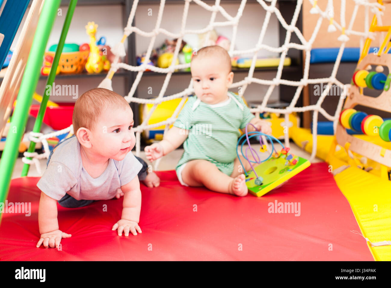 Two babies having fun Stock Photo - Alamy