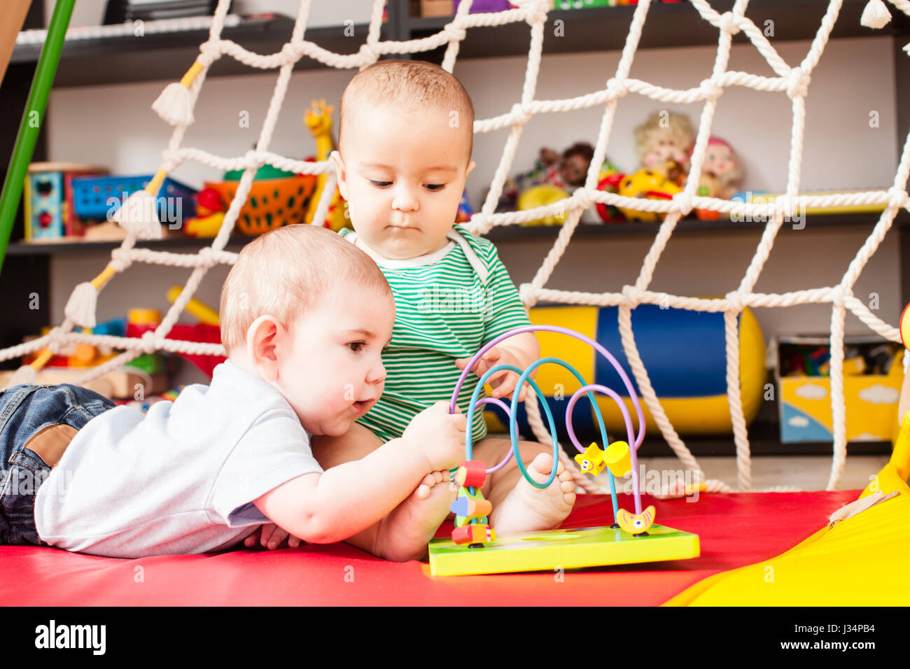 Two babies having fun Stock Photo - Alamy