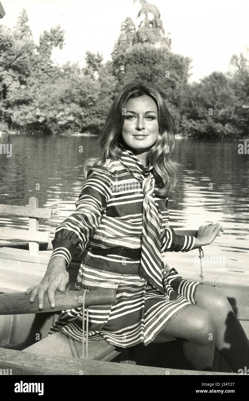 Italian showgirl Paola Piccini on a boat in the lake Stock Photo - Alamy