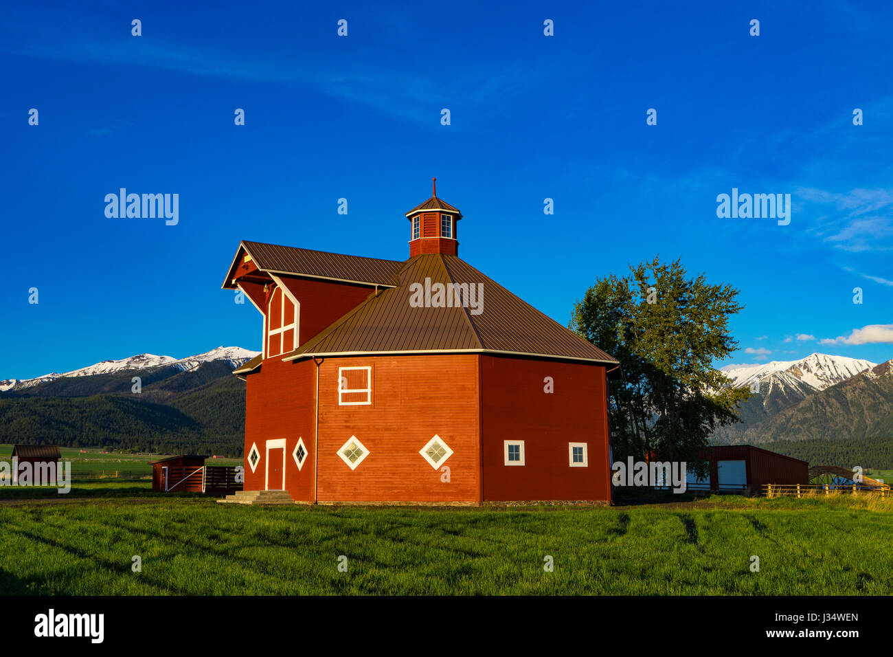 Red octagonal barn near the Wallowa Mountains in Oregon Stock Photo - Alamy