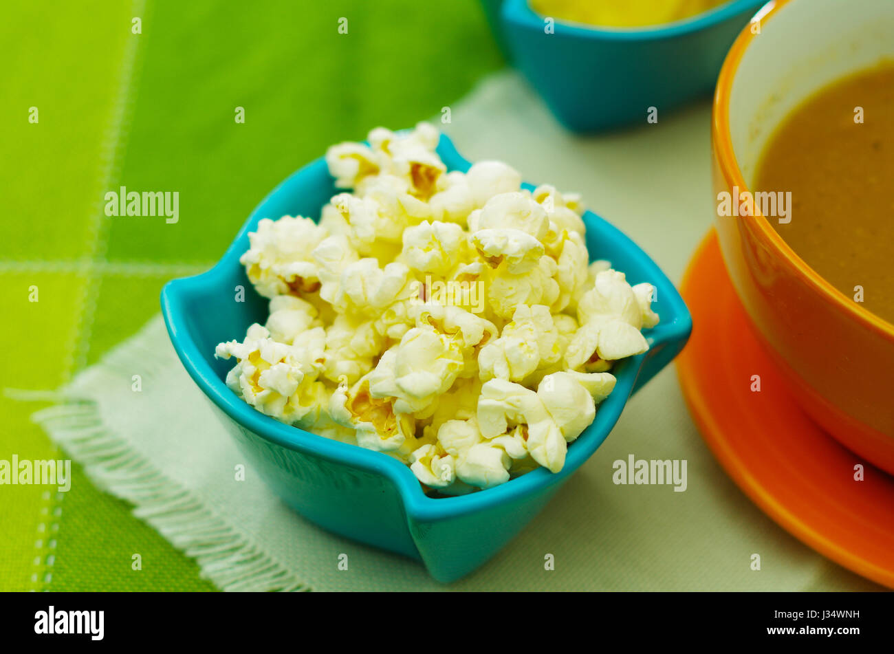 Delicious popcorn inside of a magenta bowl Stock Photo - Alamy