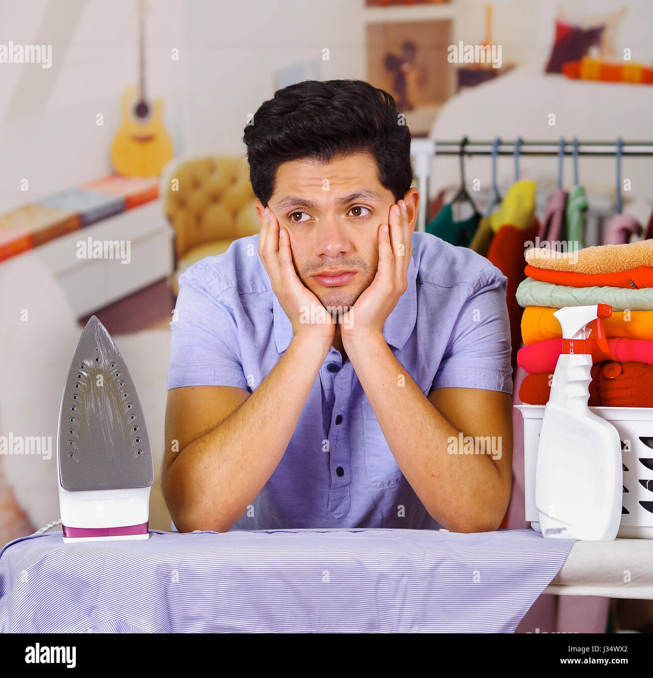 Handsome young Man worried how to Ironing the Clothes while he put his ...