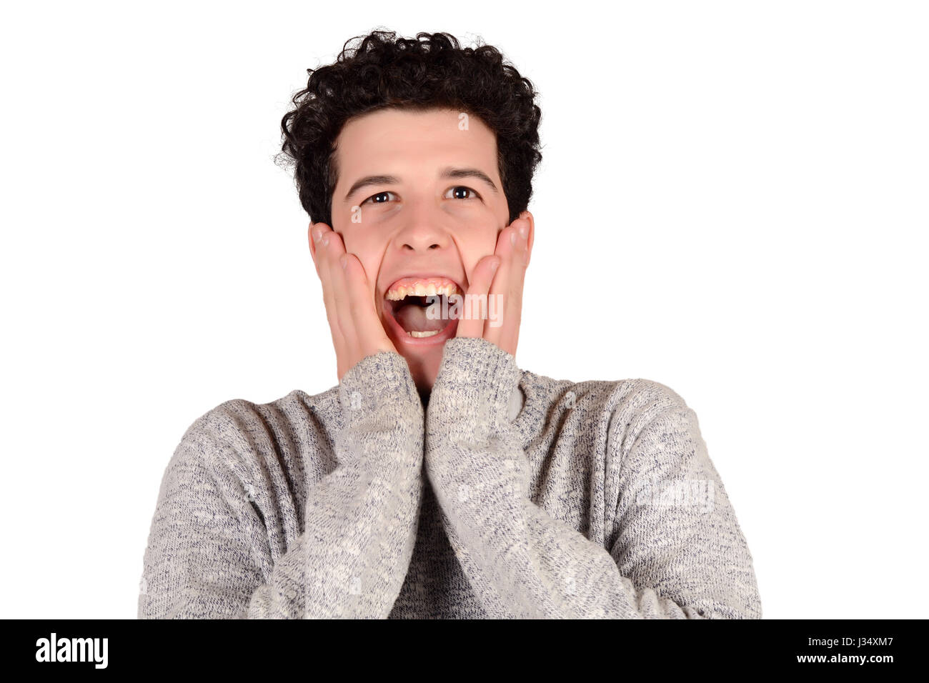 Portrait of a young amazed man. Isolated white background Stock Photo ...