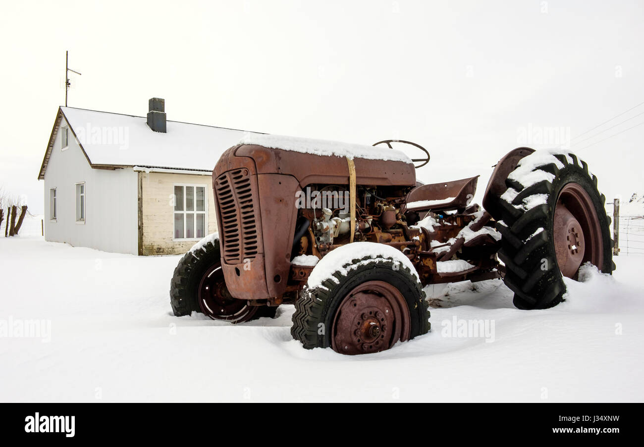 ICELAND - CIRCA MARCH 2015: Old tractor covered in snow close to a ...