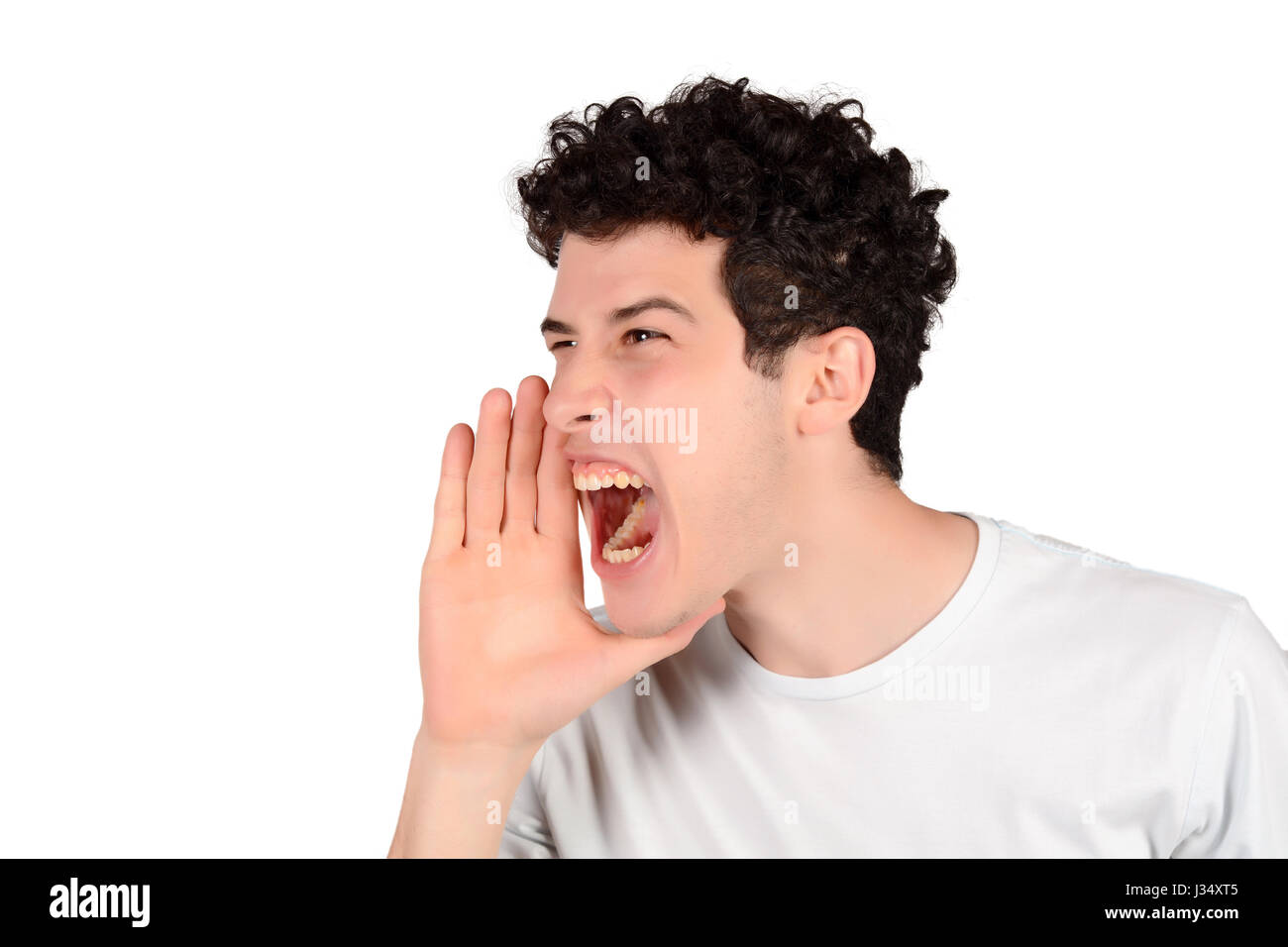Portrait of a young man shouting. Isolated white background Stock Photo ...