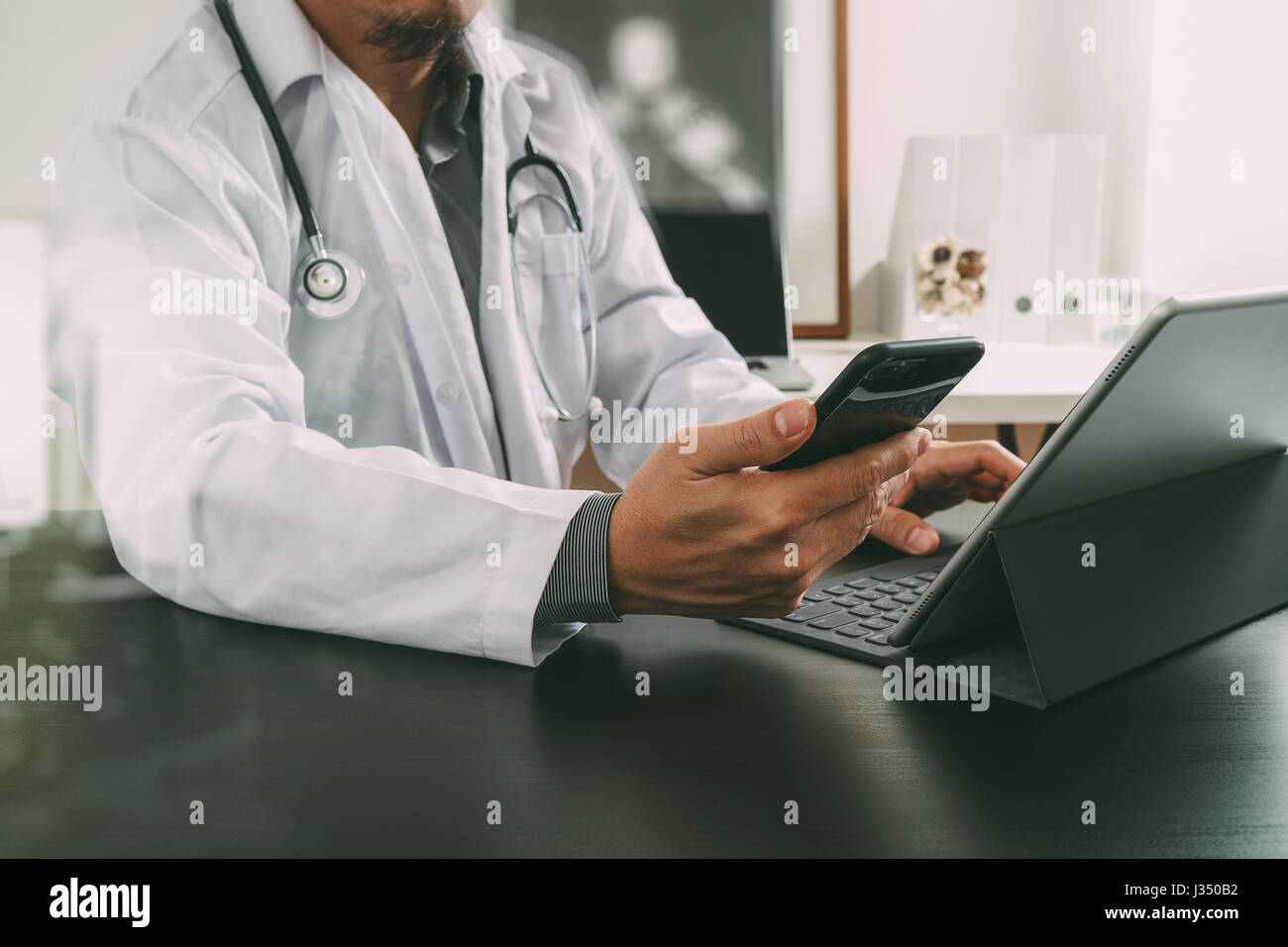 Medical technology concept. Doctor working with smart phone and ...