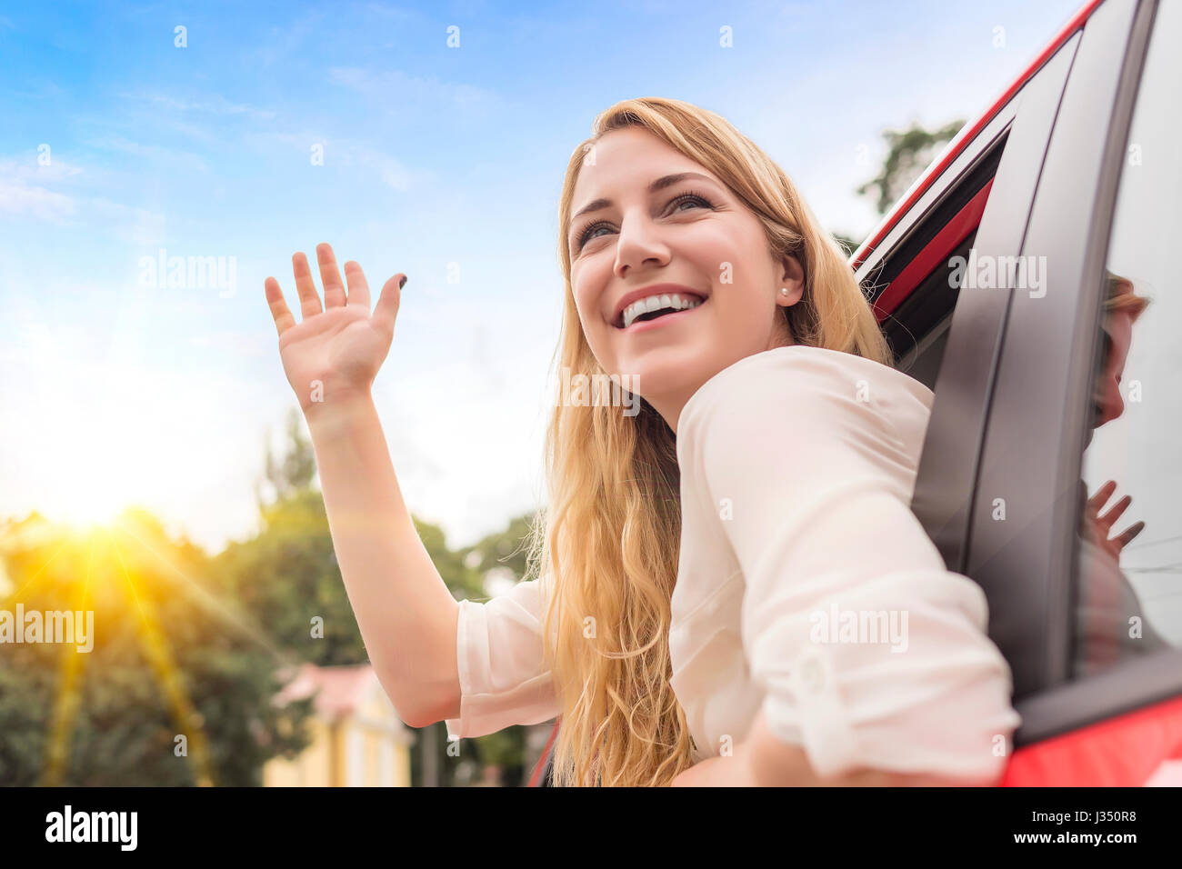 Hand waving from car hi-res stock photography and images - Alamy