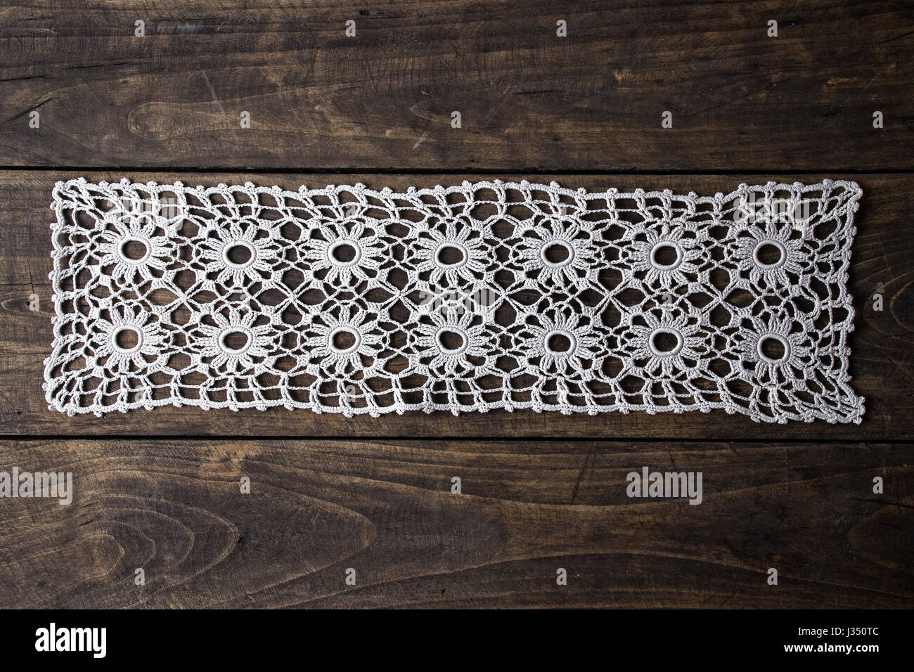 Crocheted Doily on wooden table, from above Stock Photo - Alamy