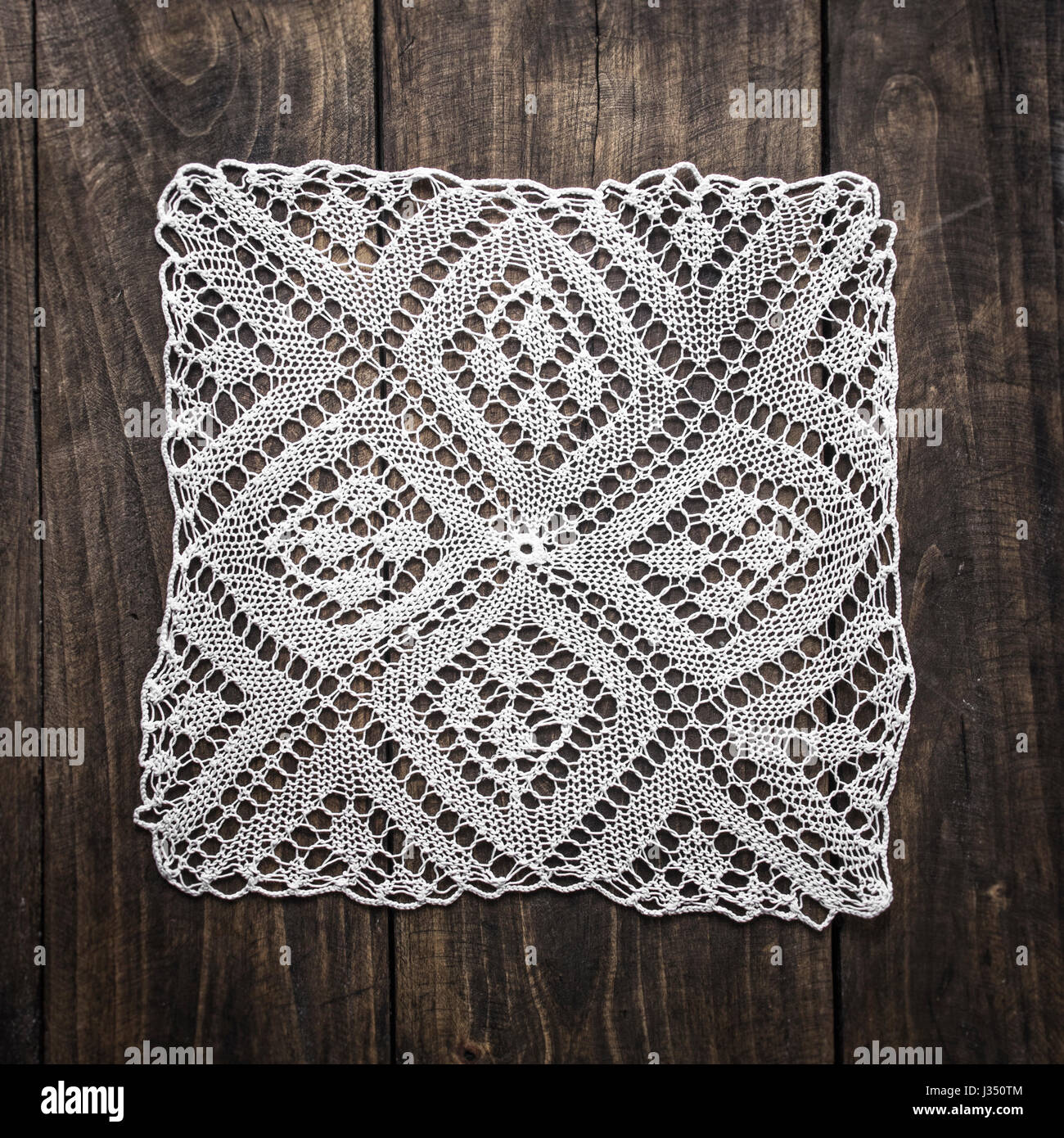 Crocheted Doily on wooden table, from above Stock Photo - Alamy