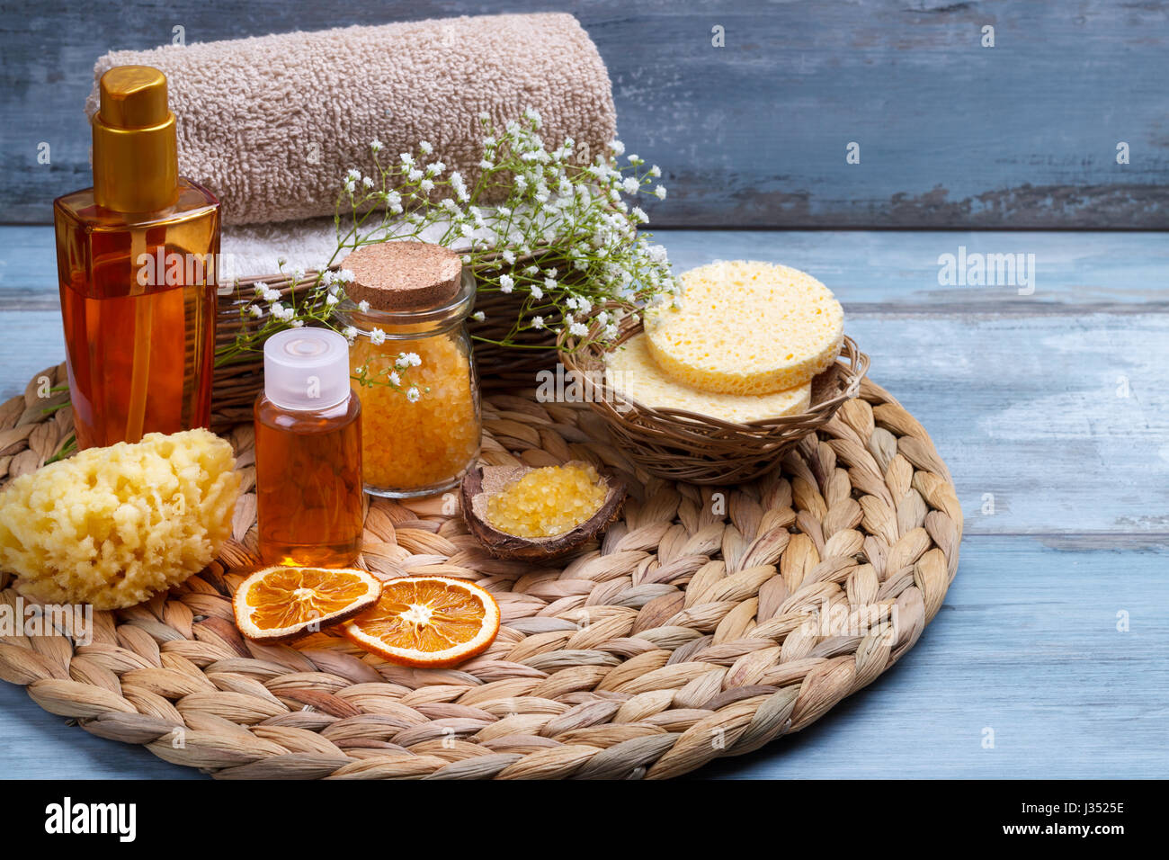 Orange Spa and wellness setting and health care items on blue ...