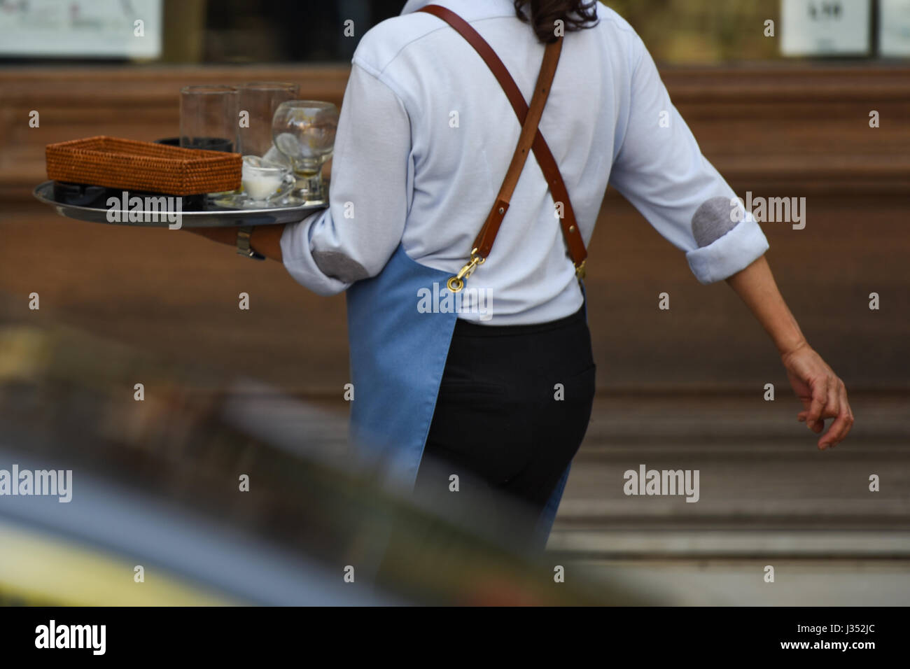 Waitress carrying dishes Stock Photo - Alamy