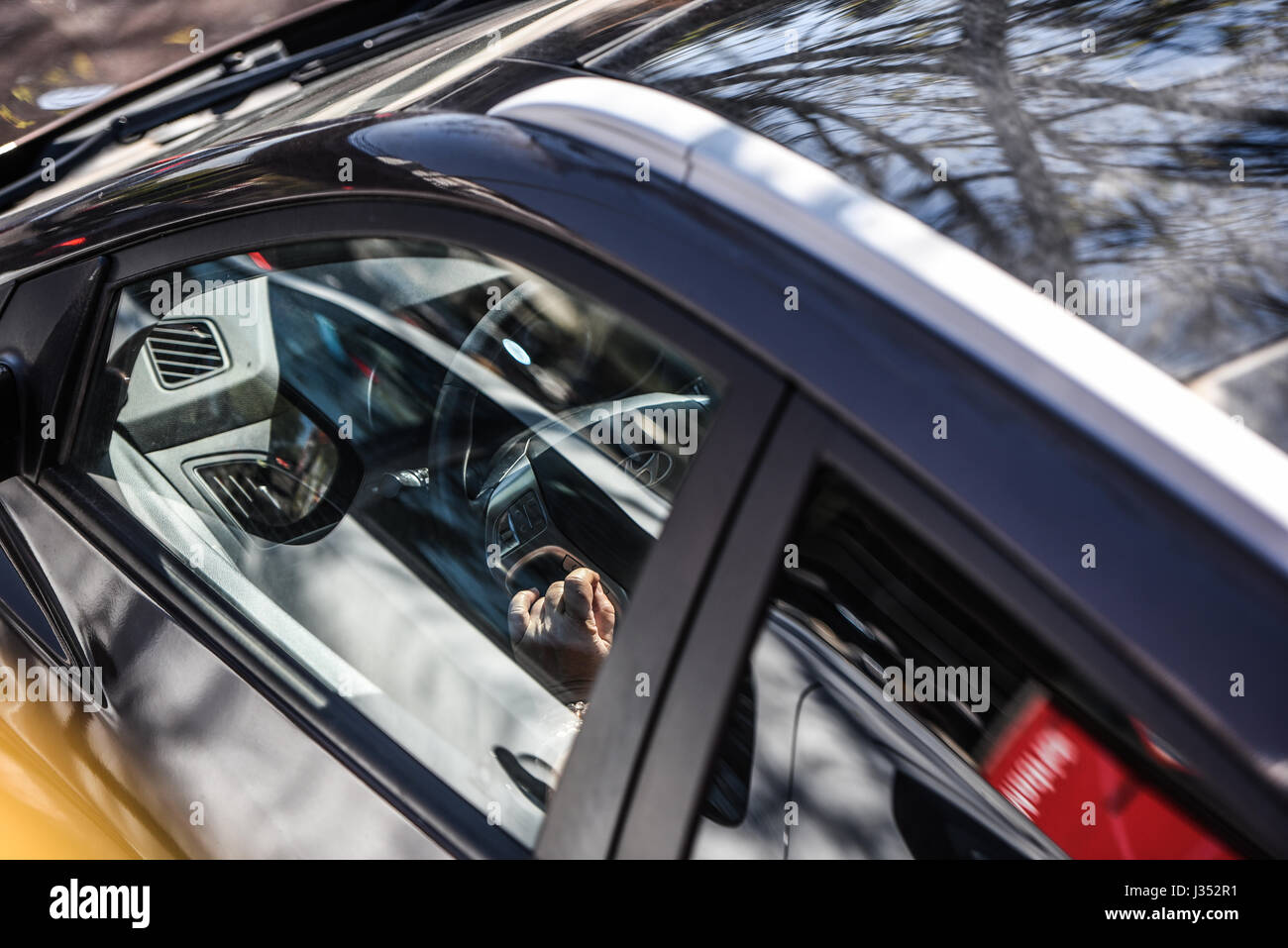 Driver from above driving a car holding a steering wheel Stock Photo ...