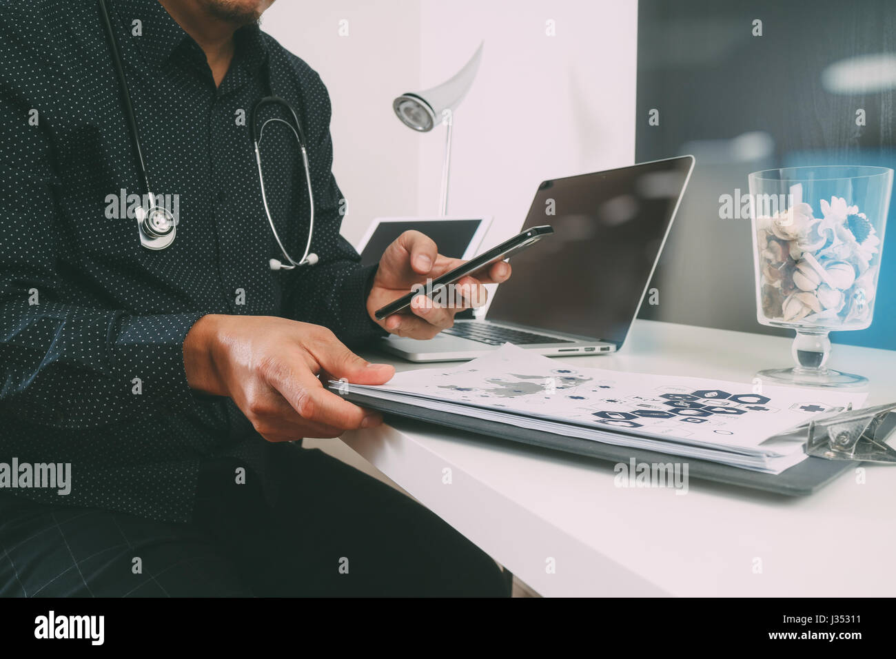 smart medical doctor working with smart phone and digital tablet and ...