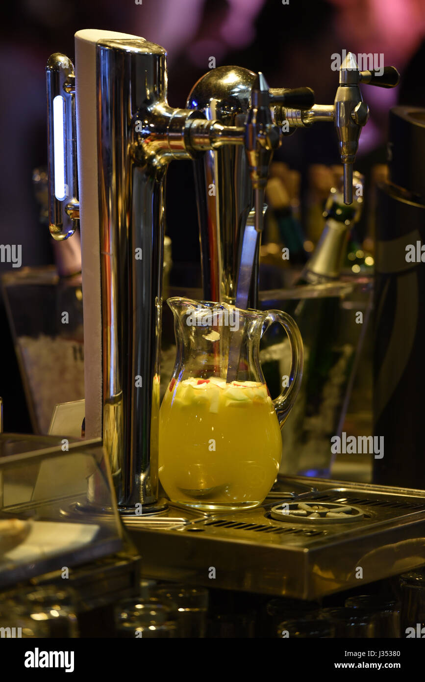 Yellow refreshing drink in a bar Stock Photo - Alamy
