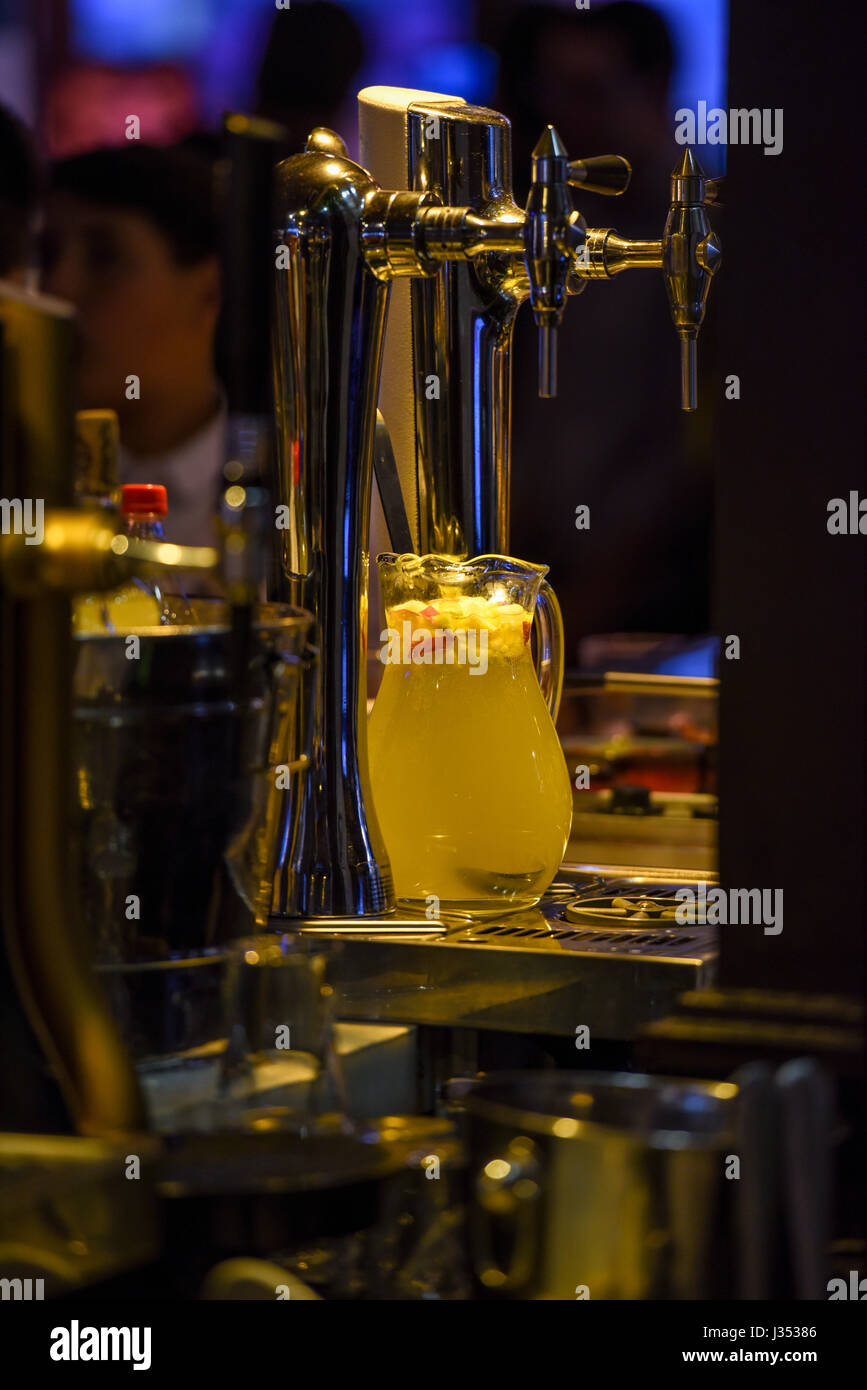 Yellow refreshing drink in a bar Stock Photo - Alamy
