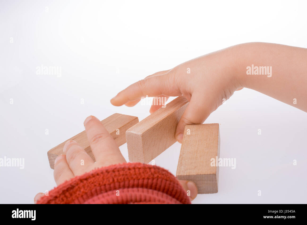 Child playing with building blocks on white background Stock Photo - Alamy