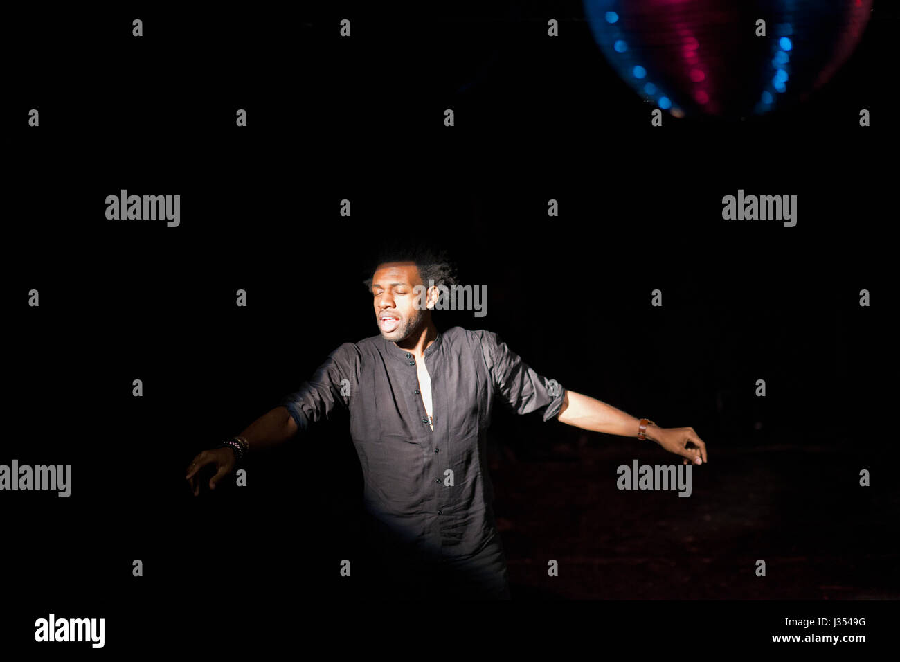 Young actor performing on stage Stock Photo - Alamy