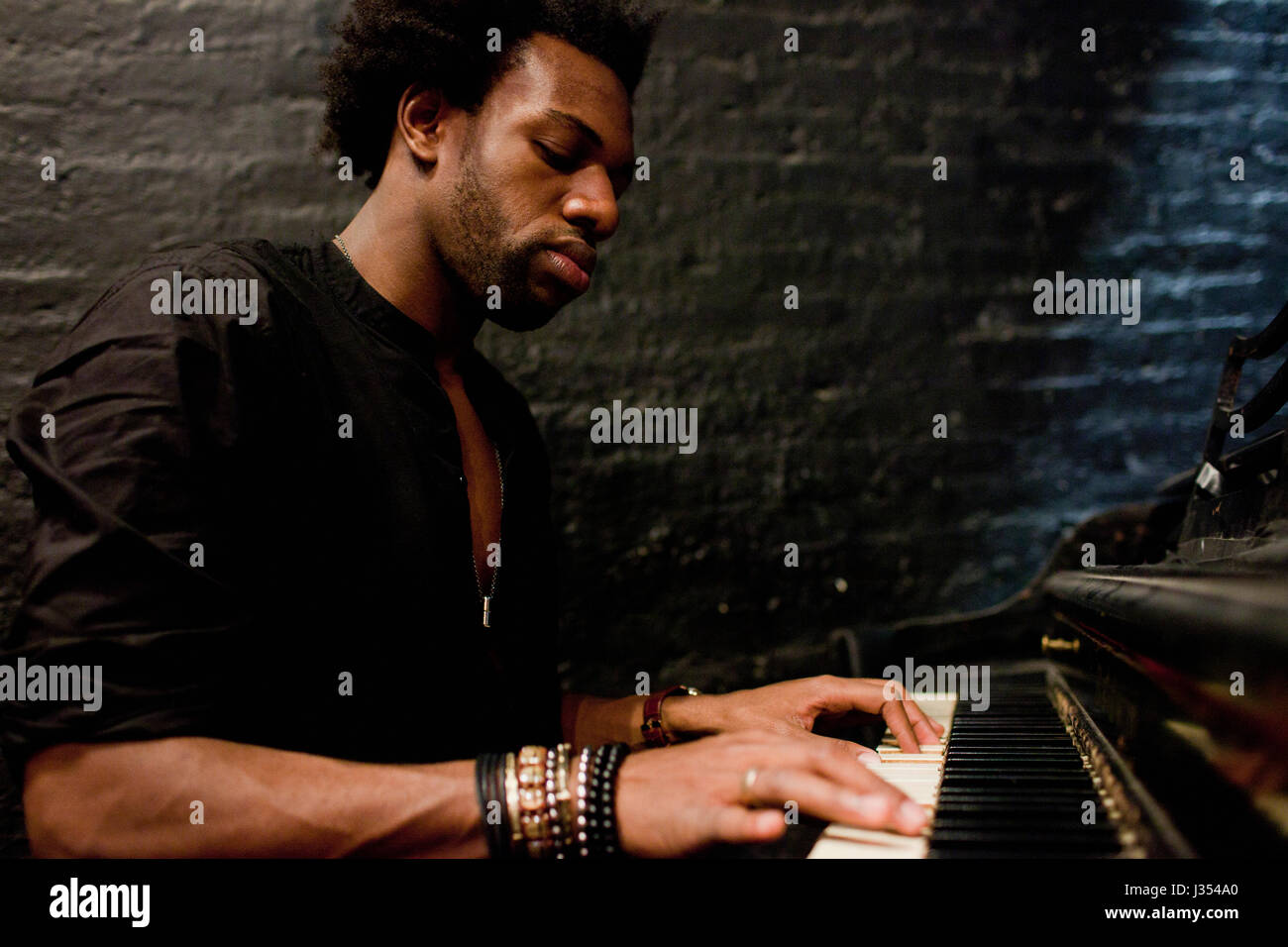 portrait of a young man playing piano Stock Photo - Alamy