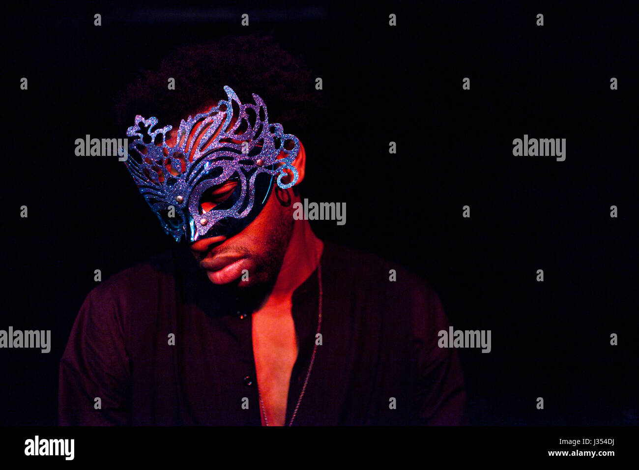 Young actor performing on stage in a mask Stock Photo - Alamy