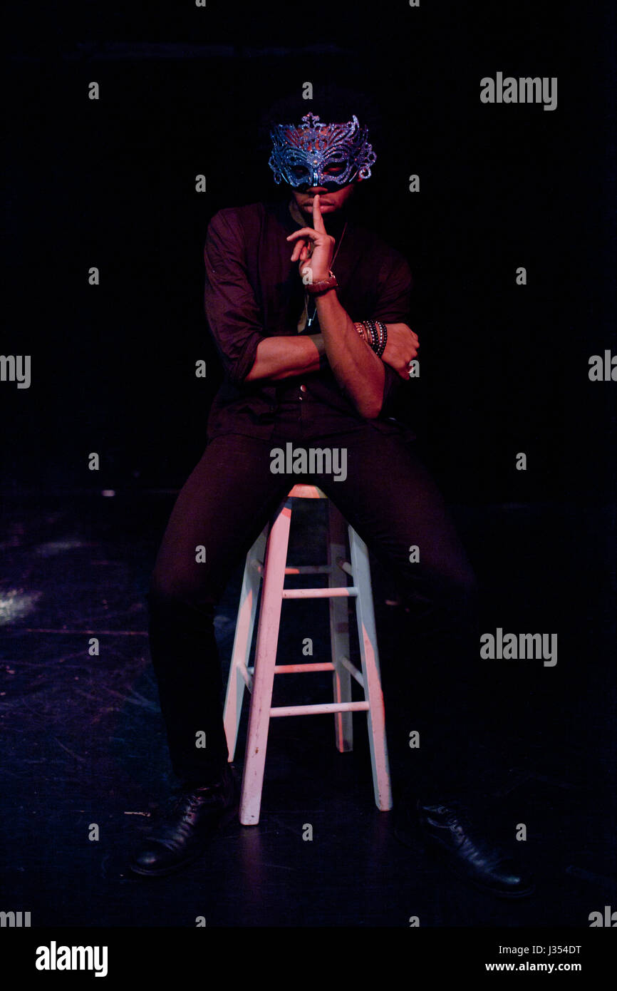 Young actor performing on stage in a mask Stock Photo - Alamy