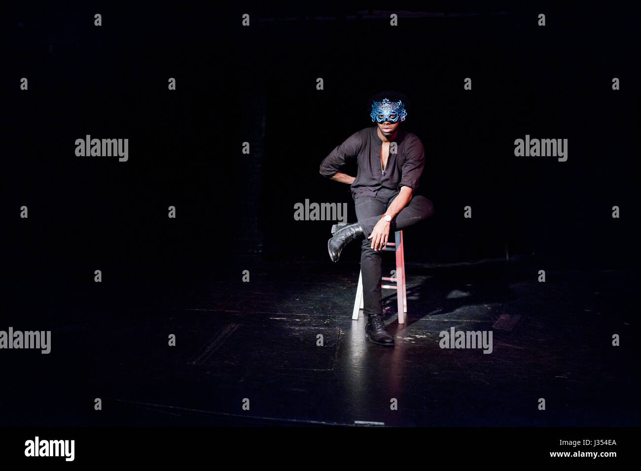 Young actor performing on stage in a mask Stock Photo - Alamy