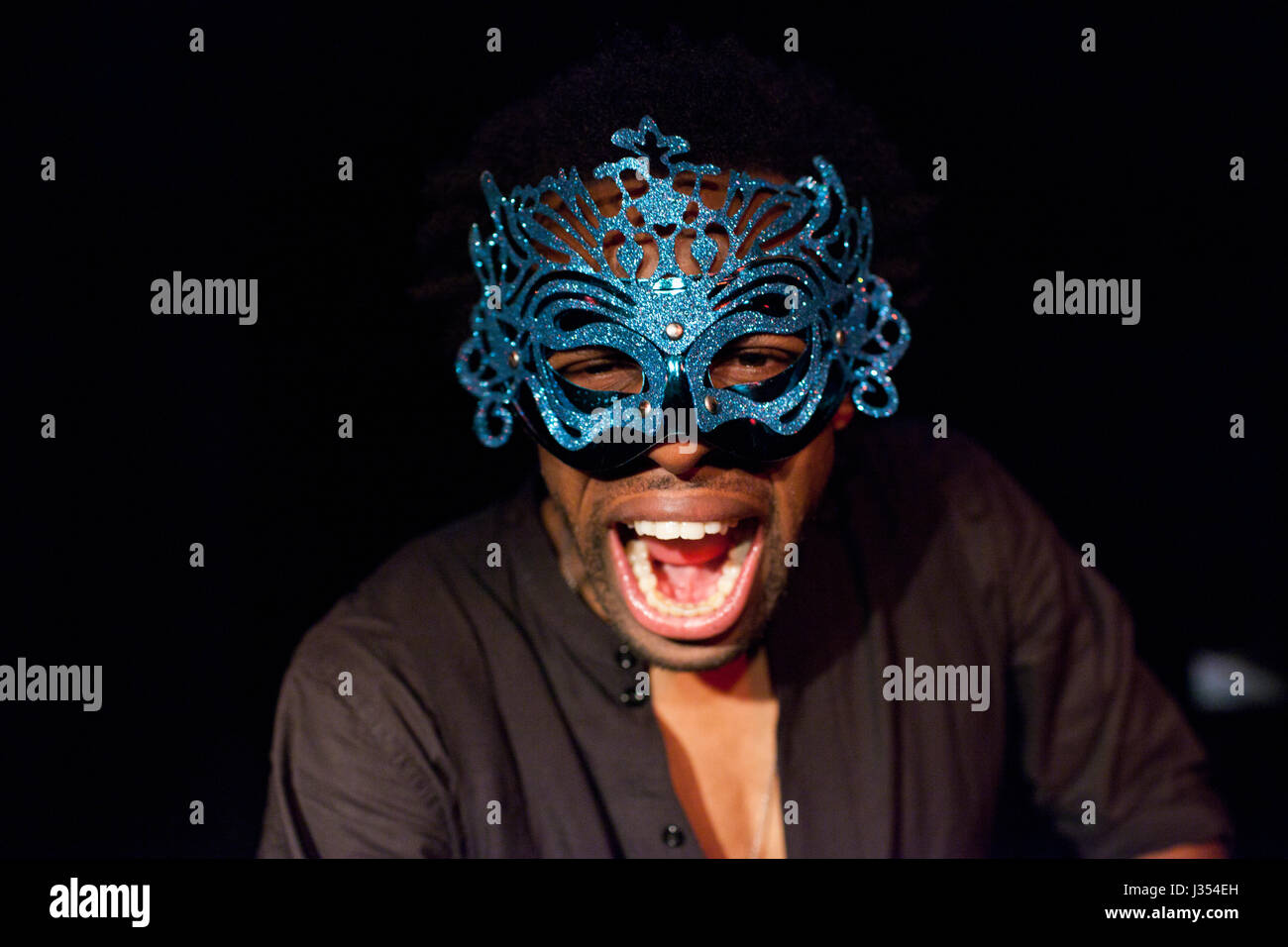 Young actor performing on stage in a mask Stock Photo - Alamy