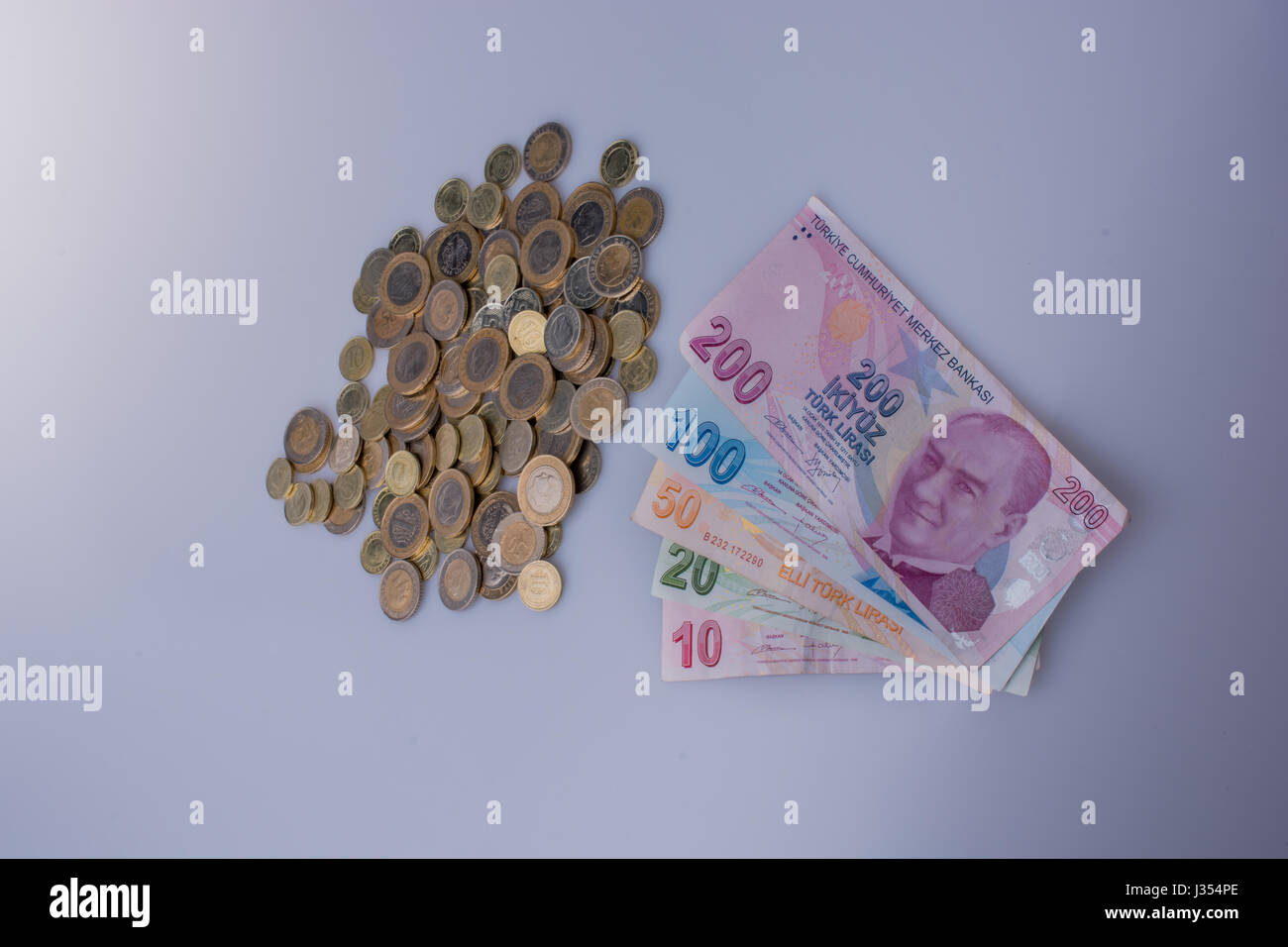 Turkish Lira coins and banknotes side by side on white background Stock ...