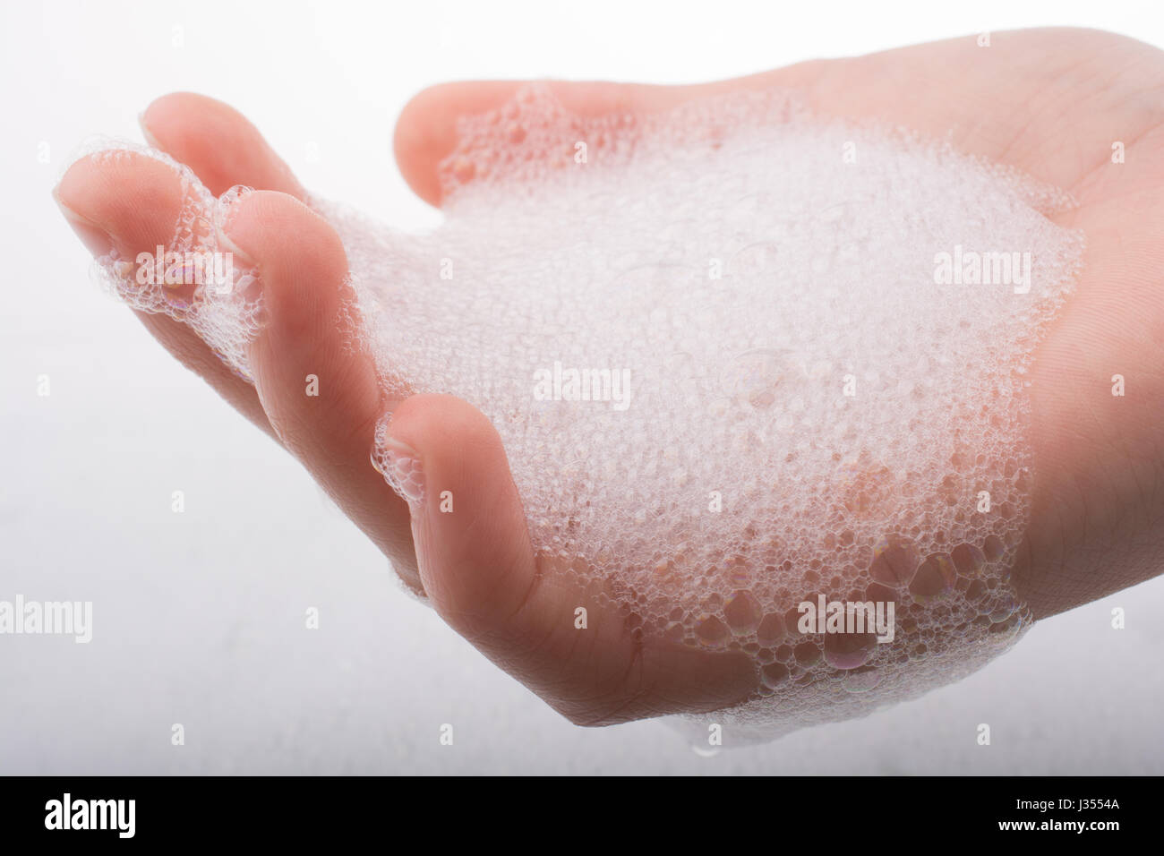 Hand washing and soap foam on a foamy background Stock Photo - Alamy