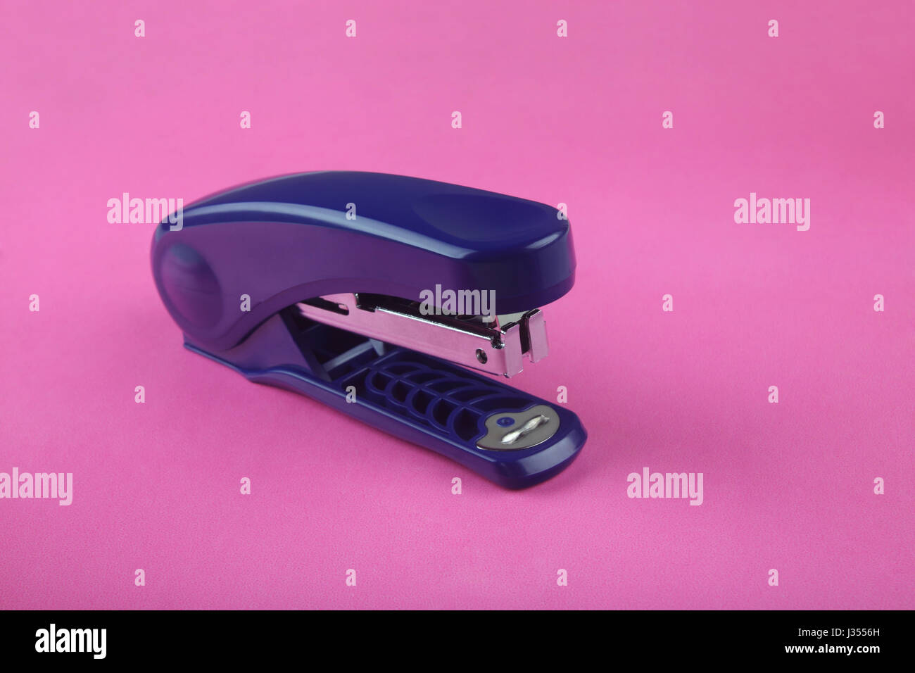 A stapler isolated on a plain background Stock Photo - Alamy