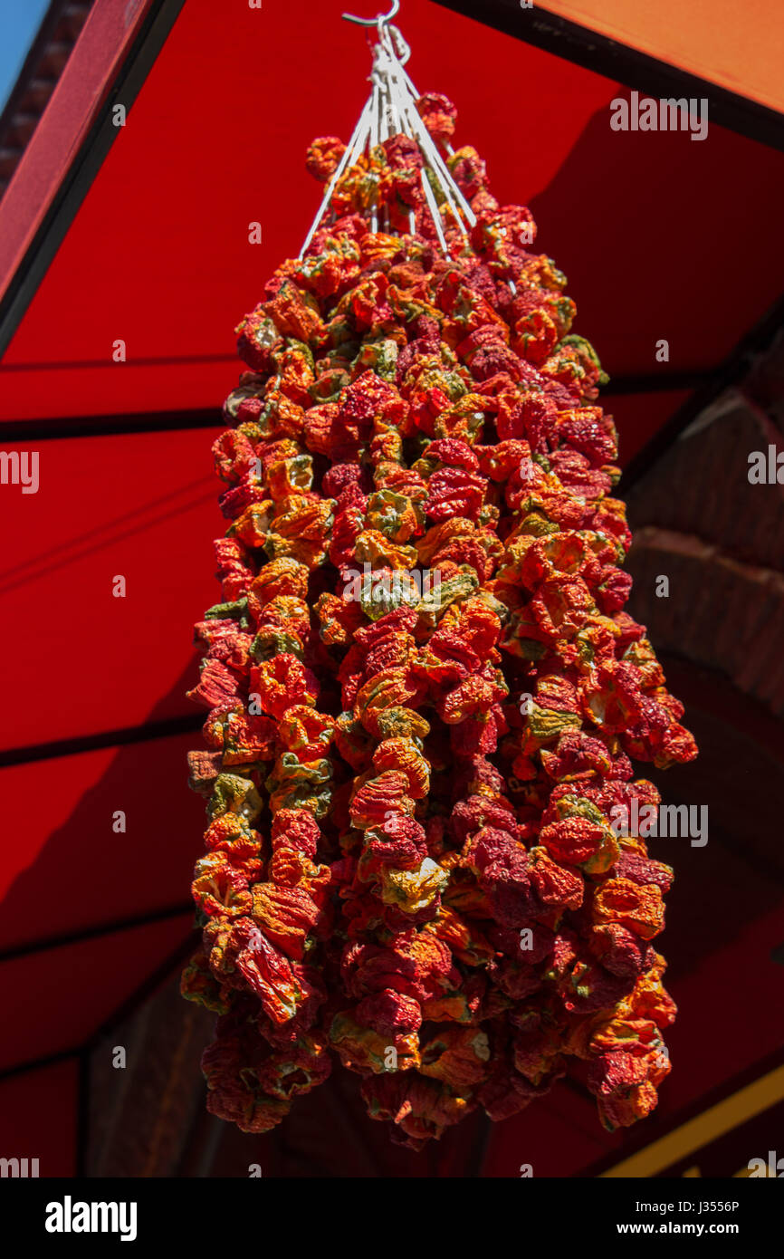 Bundles of red chili peppers dry in the sun Stock Photo - Alamy