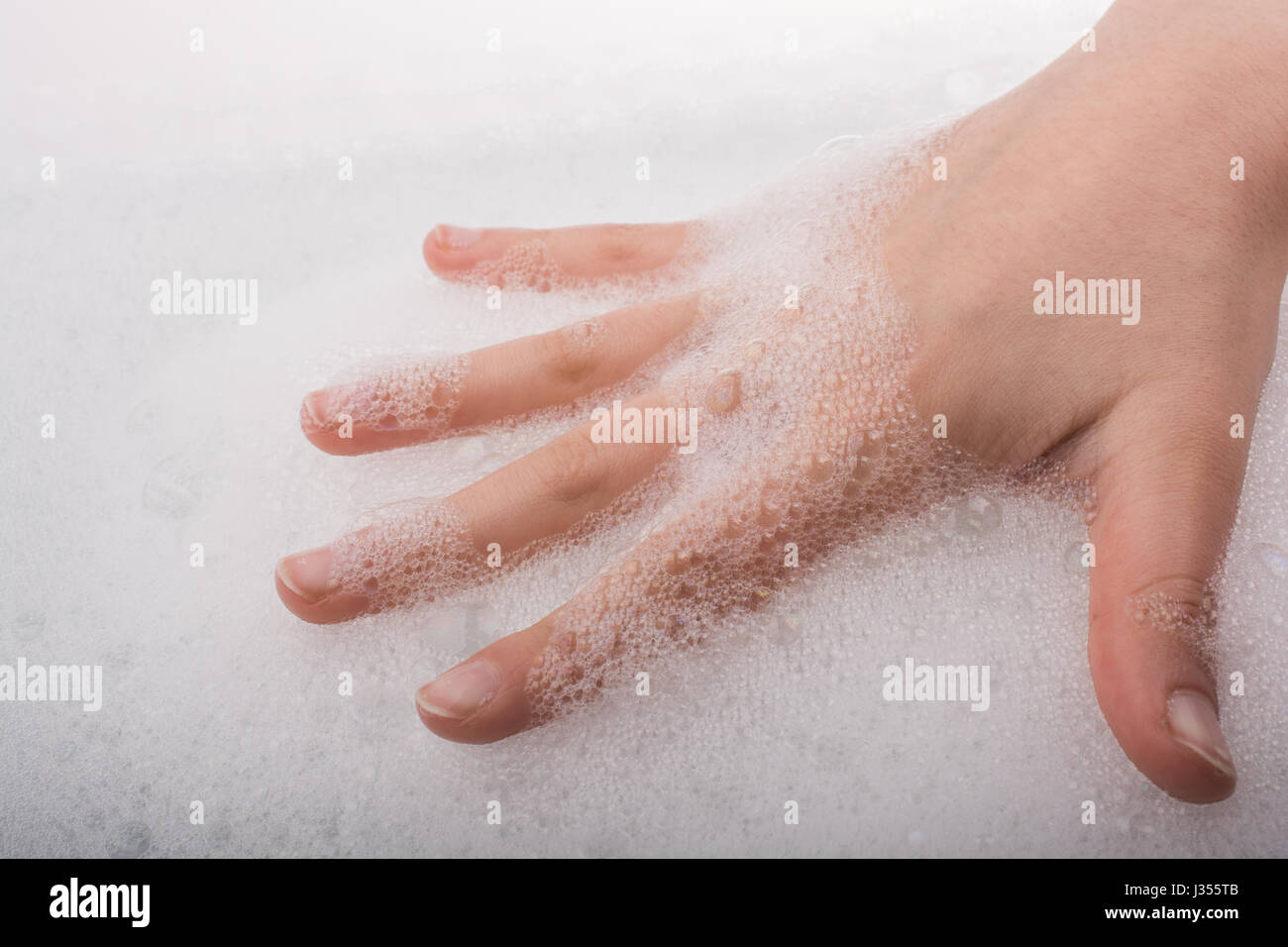 Hand washing and soap foam on a foamy background Stock Photo - Alamy