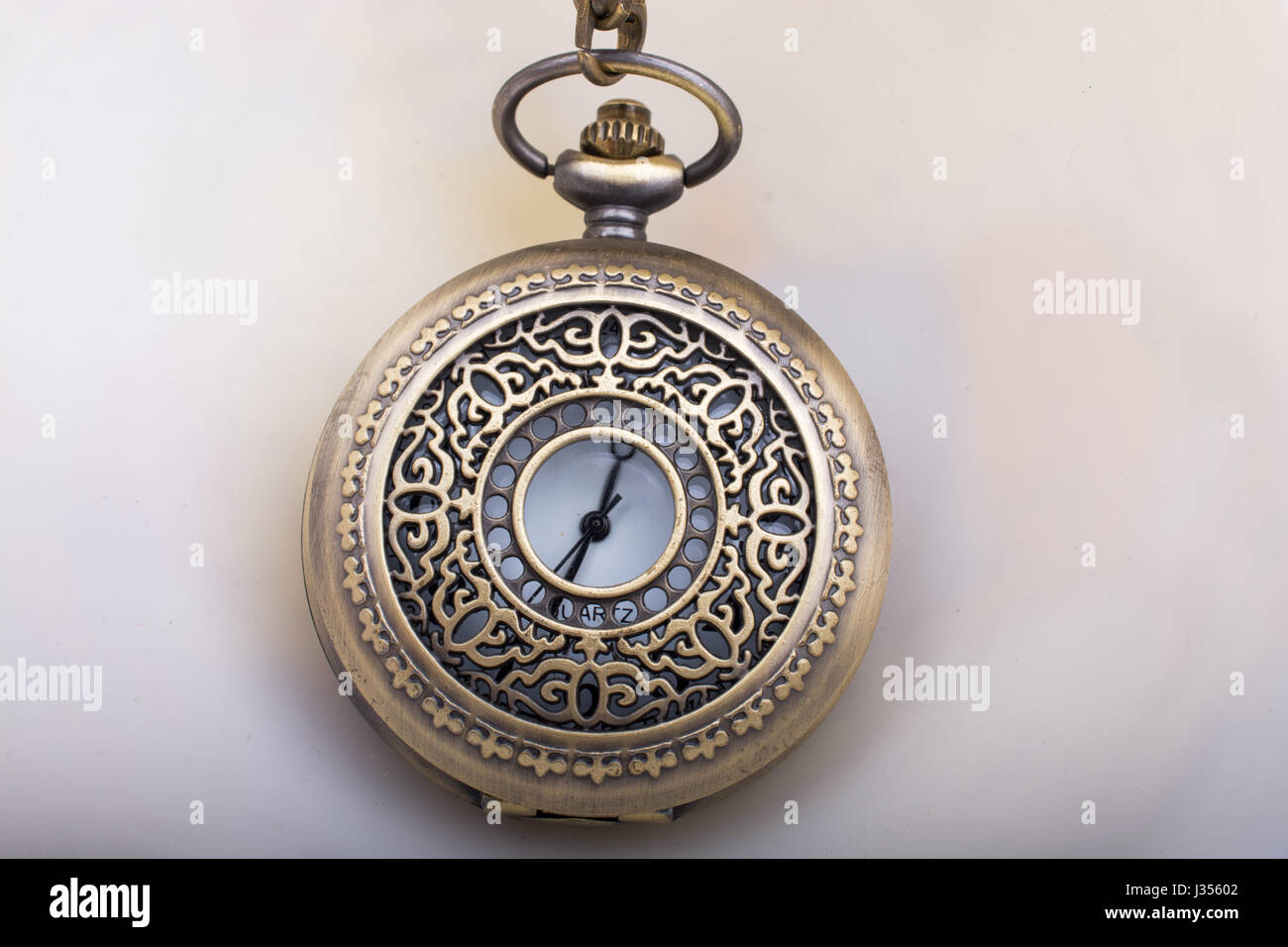 Retro style pocket watch on white background Stock Photo - Alamy