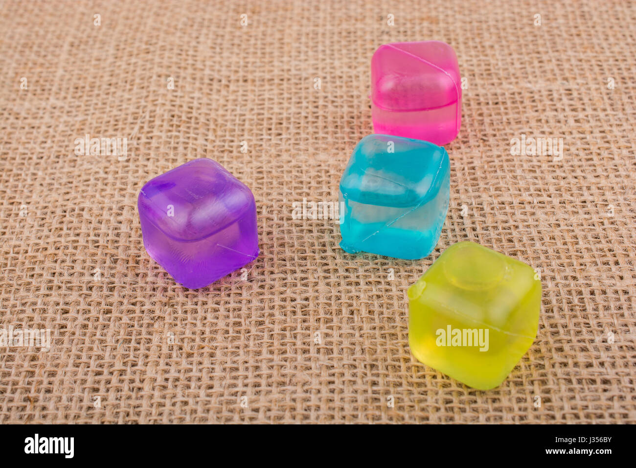 Fake colorful ice cubes on a linen canvas Stock Photo - Alamy