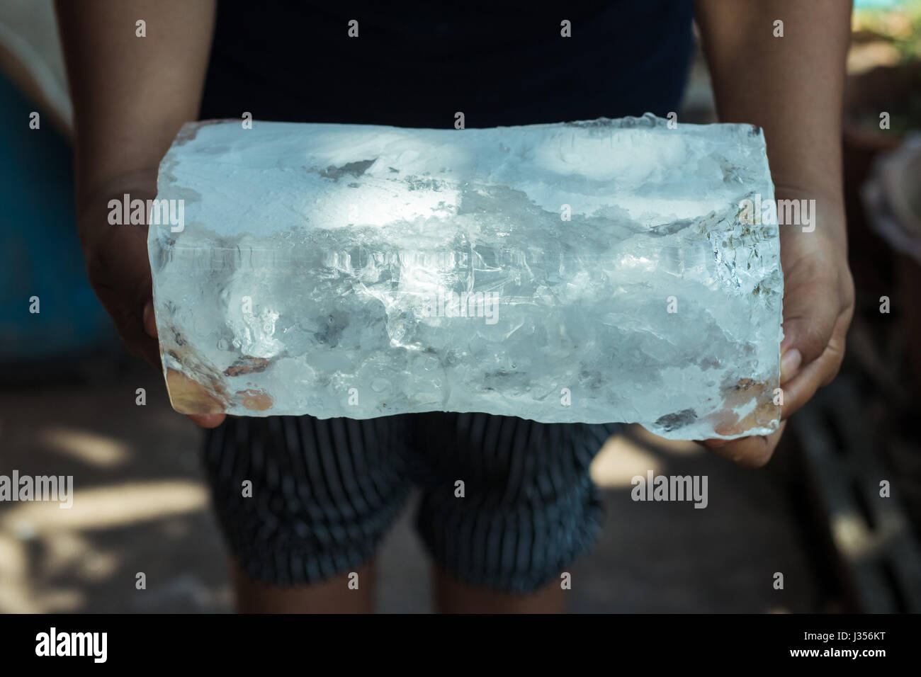 Person with hands holding large object hi-res stock photography and ...