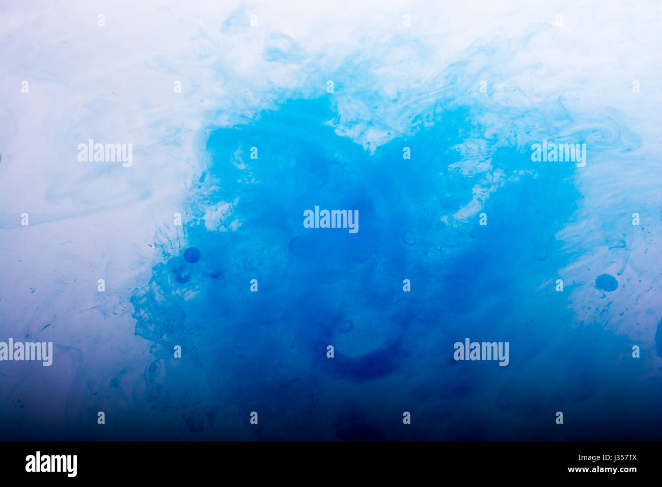 Watercolor paint dissolving in pure water Stock Photo - Alamy